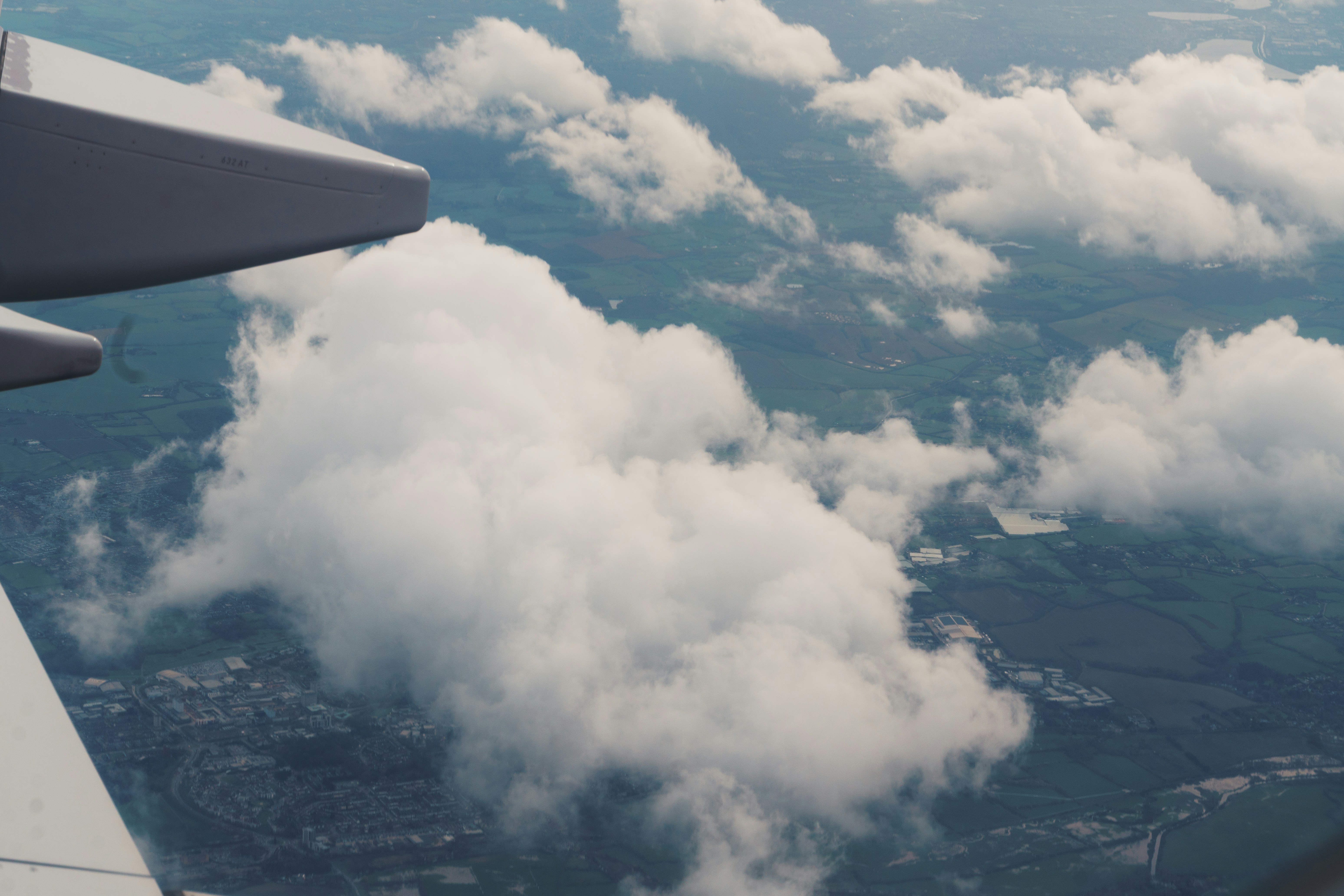 Wingtip View: Clouds Sweeping Beneath a Continental Flight