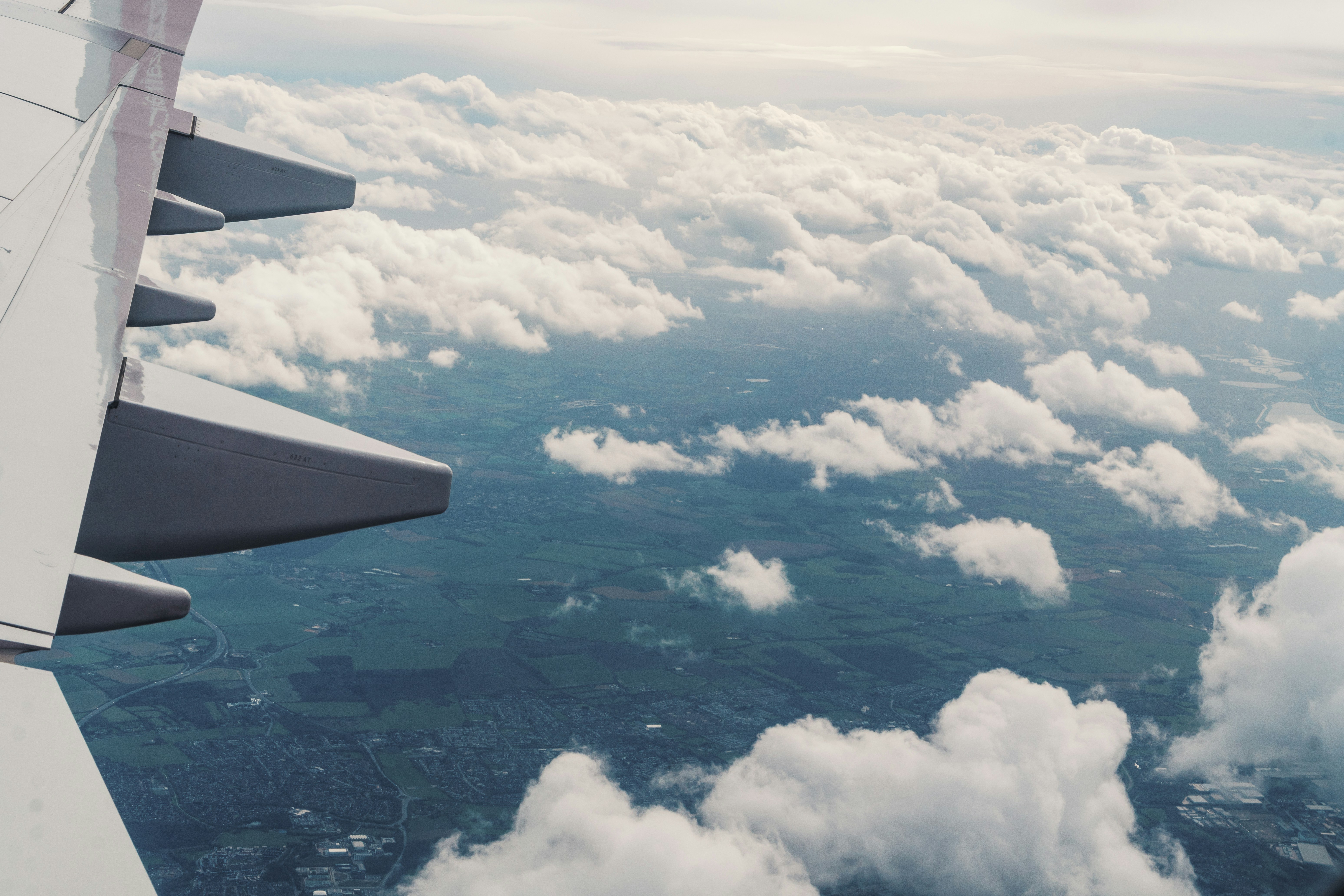 Winged Perspective: Cloudscape Over the Window
