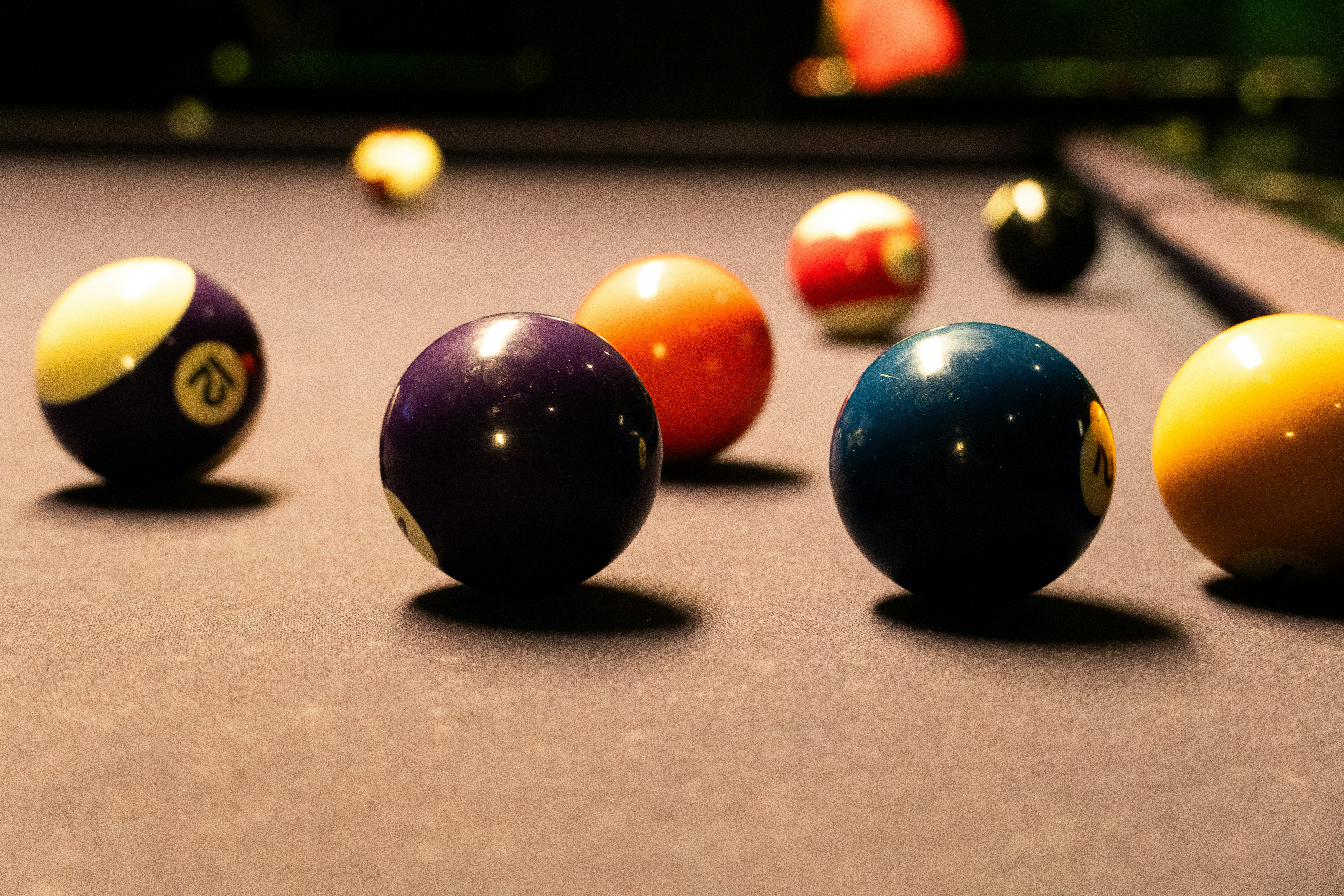 Billiards at Dusk: A Low-Angle Parade of Balls