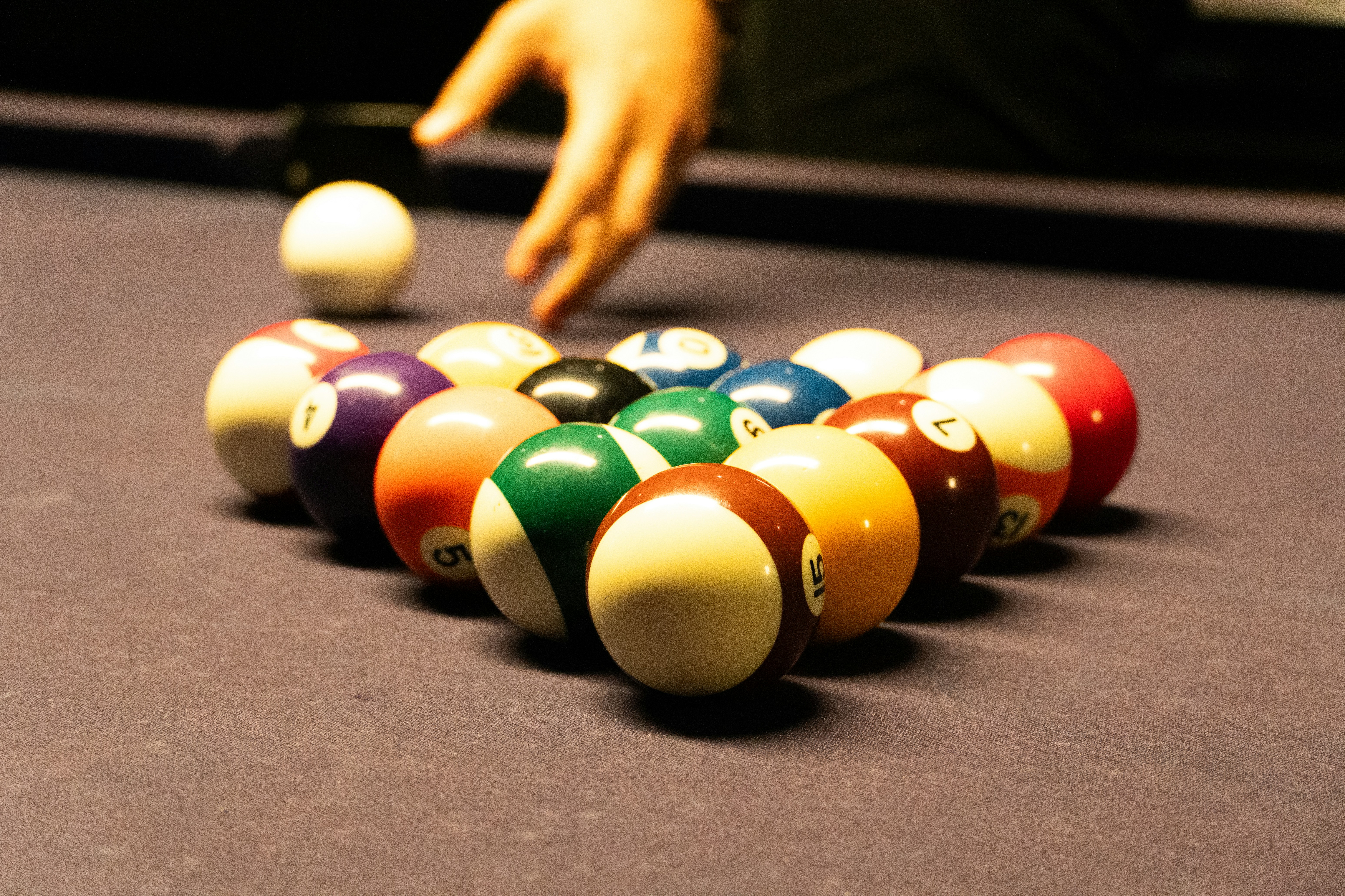 Triumph in the Rack: A Tight Cluster of Pool Balls Ready for the Break