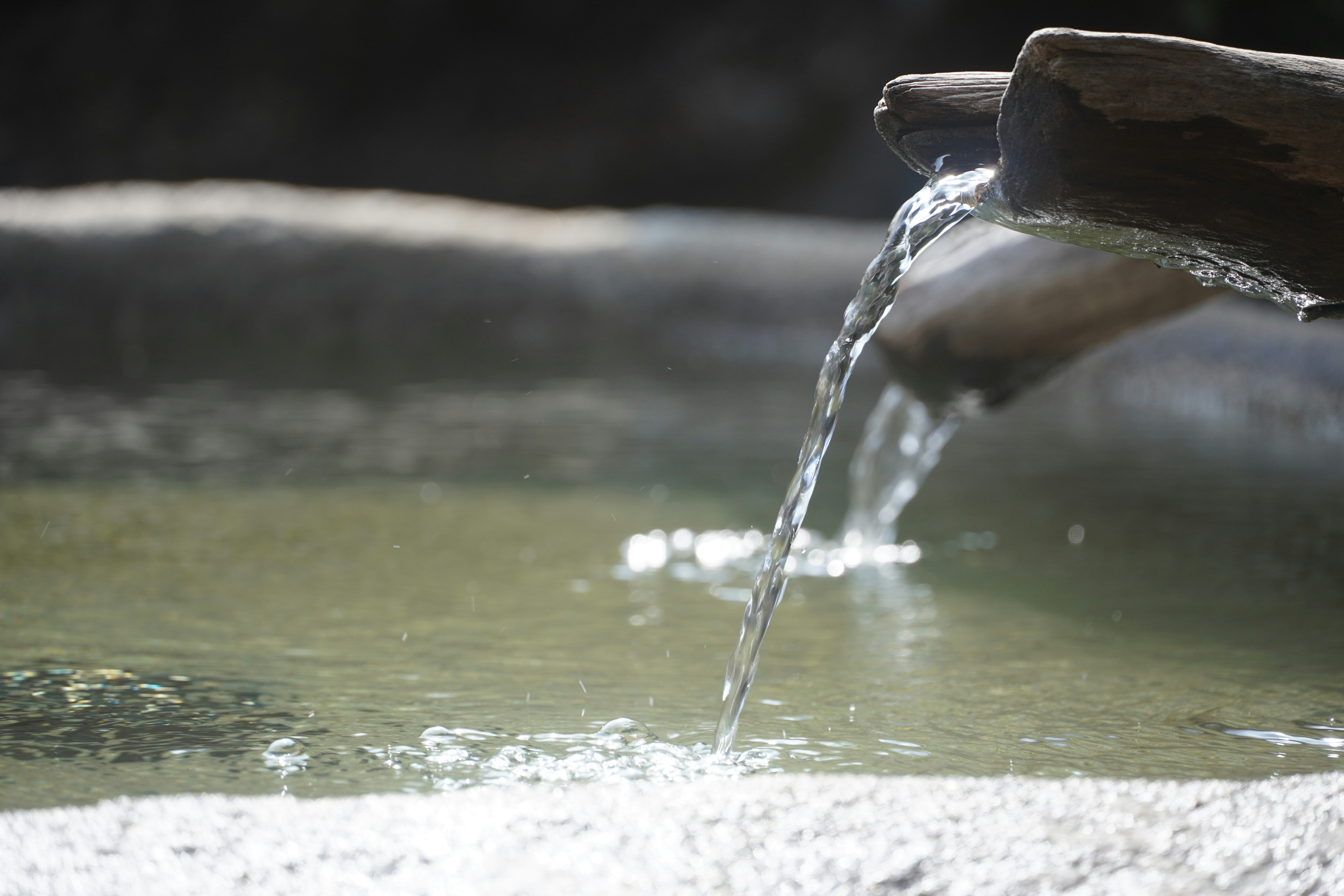 Quiet Cascade: A Stream Spout Over a Pebble Bed