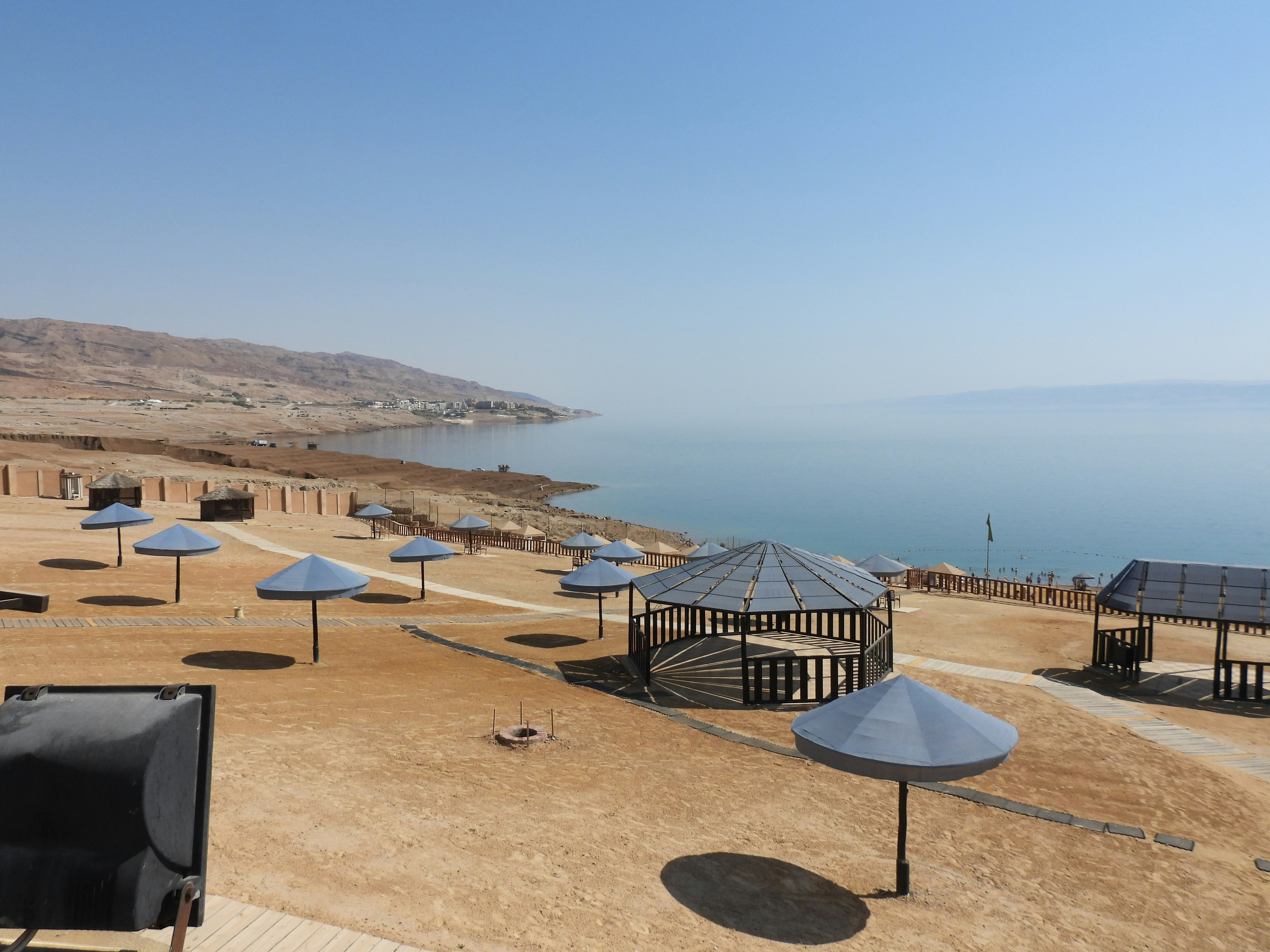 Deserted Beachside Pavilion under a Clear Blue Horizon