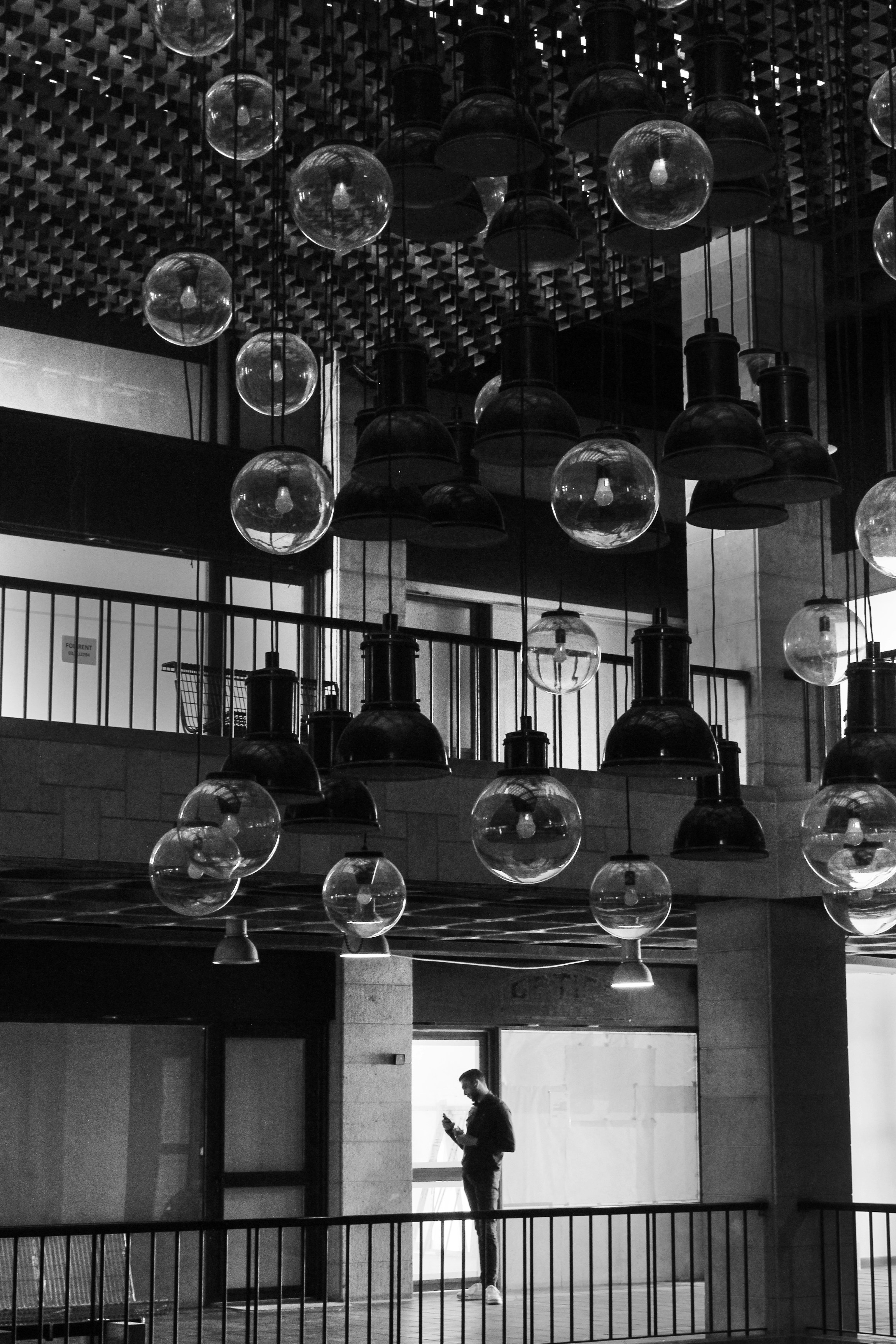 Glass Spheres and Silent Figures: A Nighttime Interior Portrait