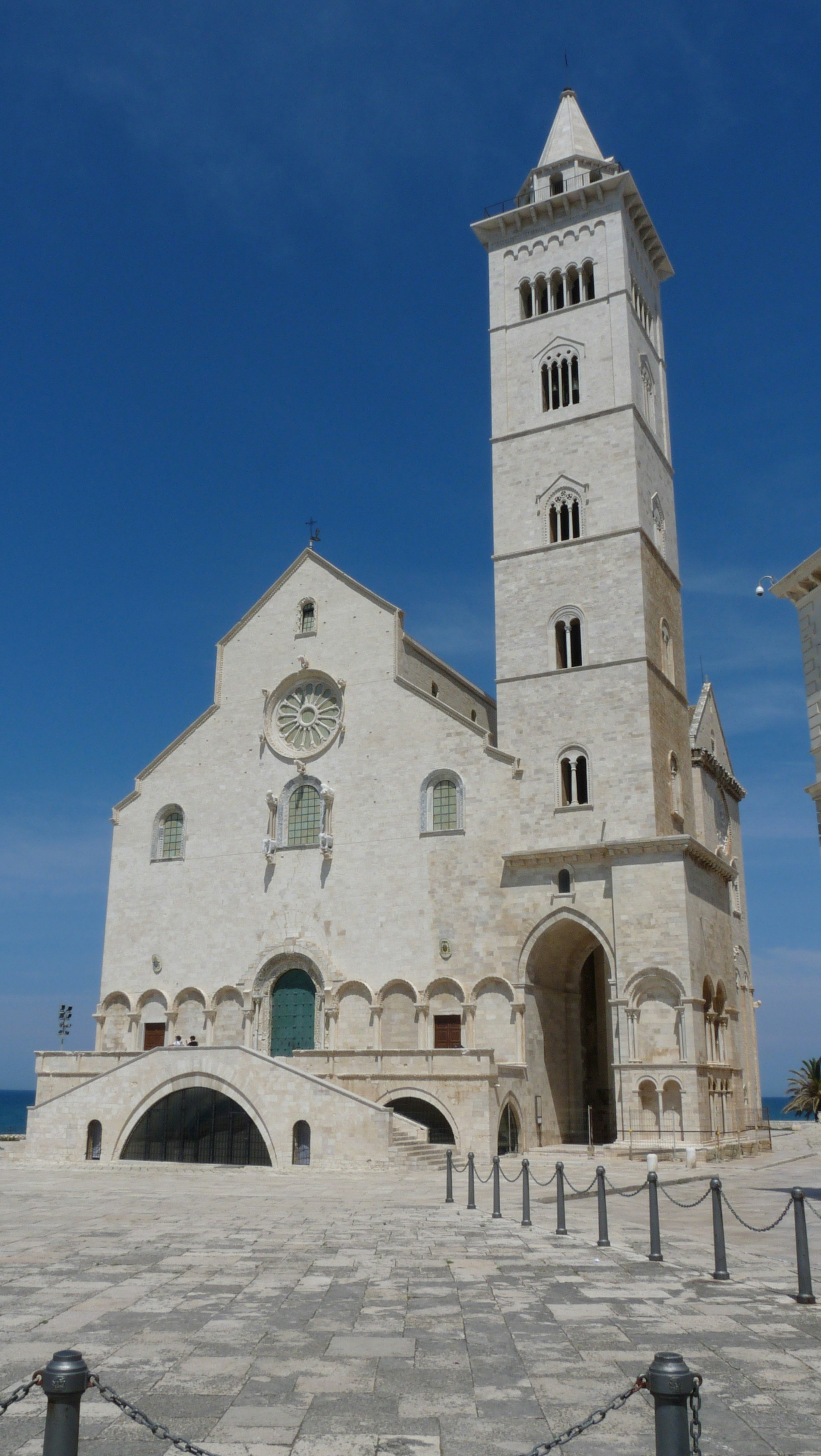 Church of the Coastal Light: Stone Archway Beneath a Clear Blue Sky