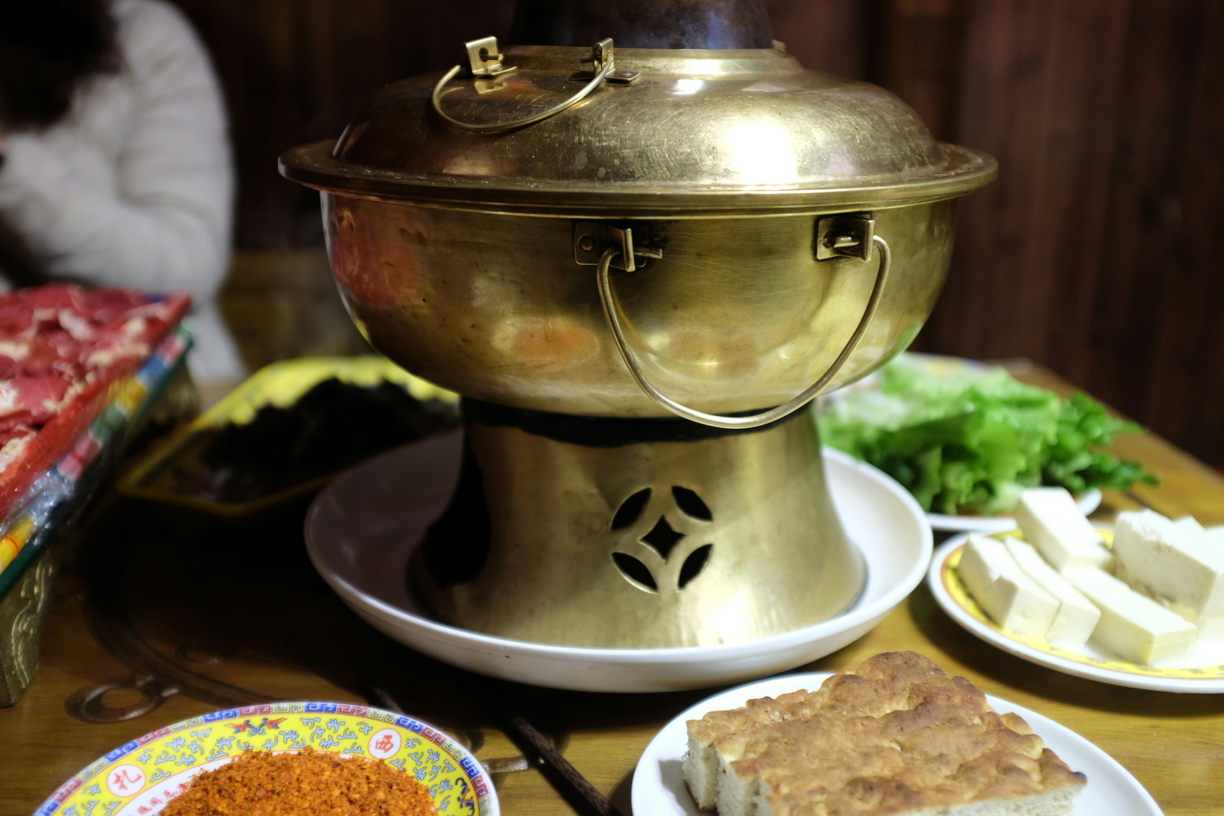 Brass Pot Centered over a Hearth: A Feast Preparations Scene