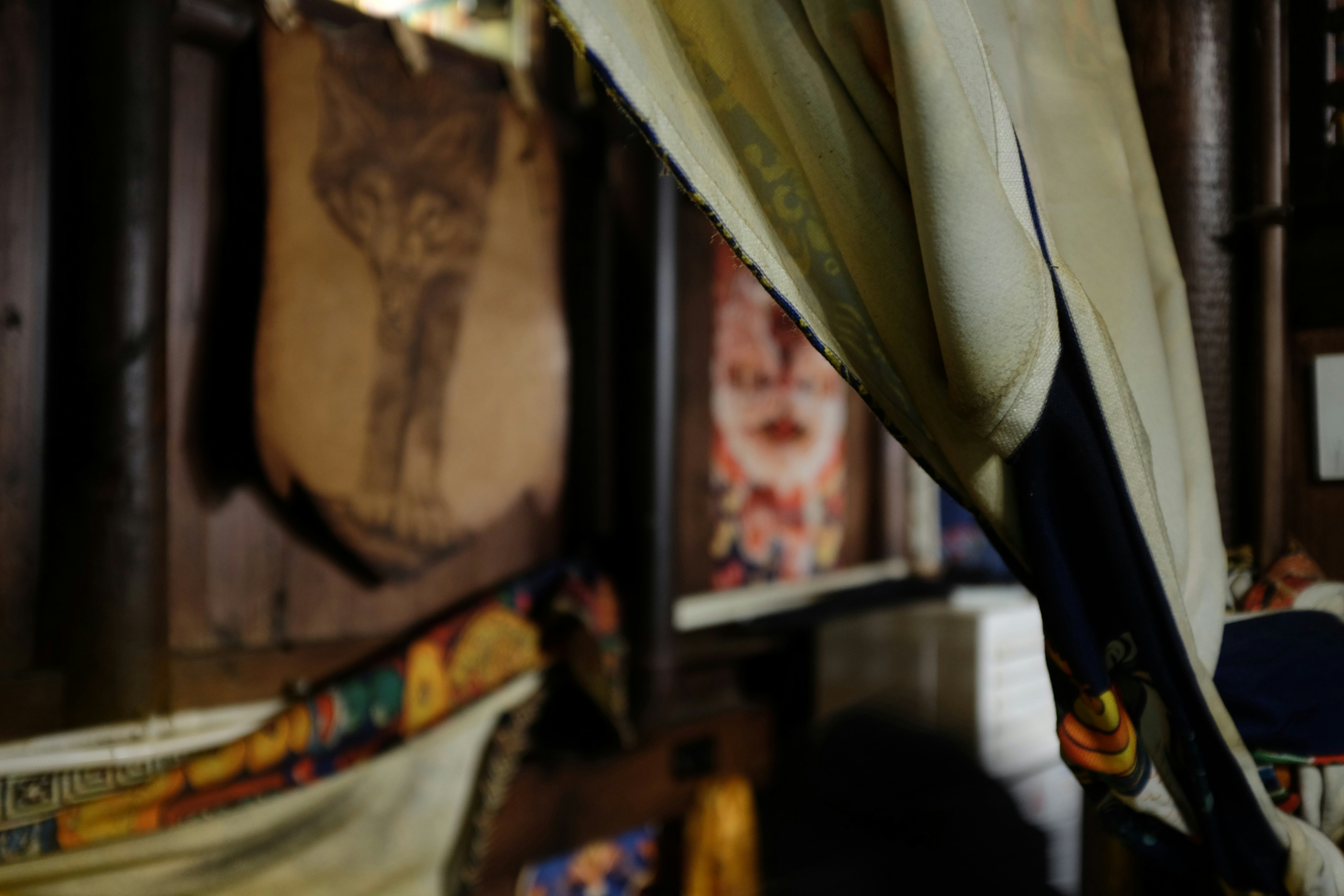 Hidden Shrine: A Tapestry of Fabrics and Icons