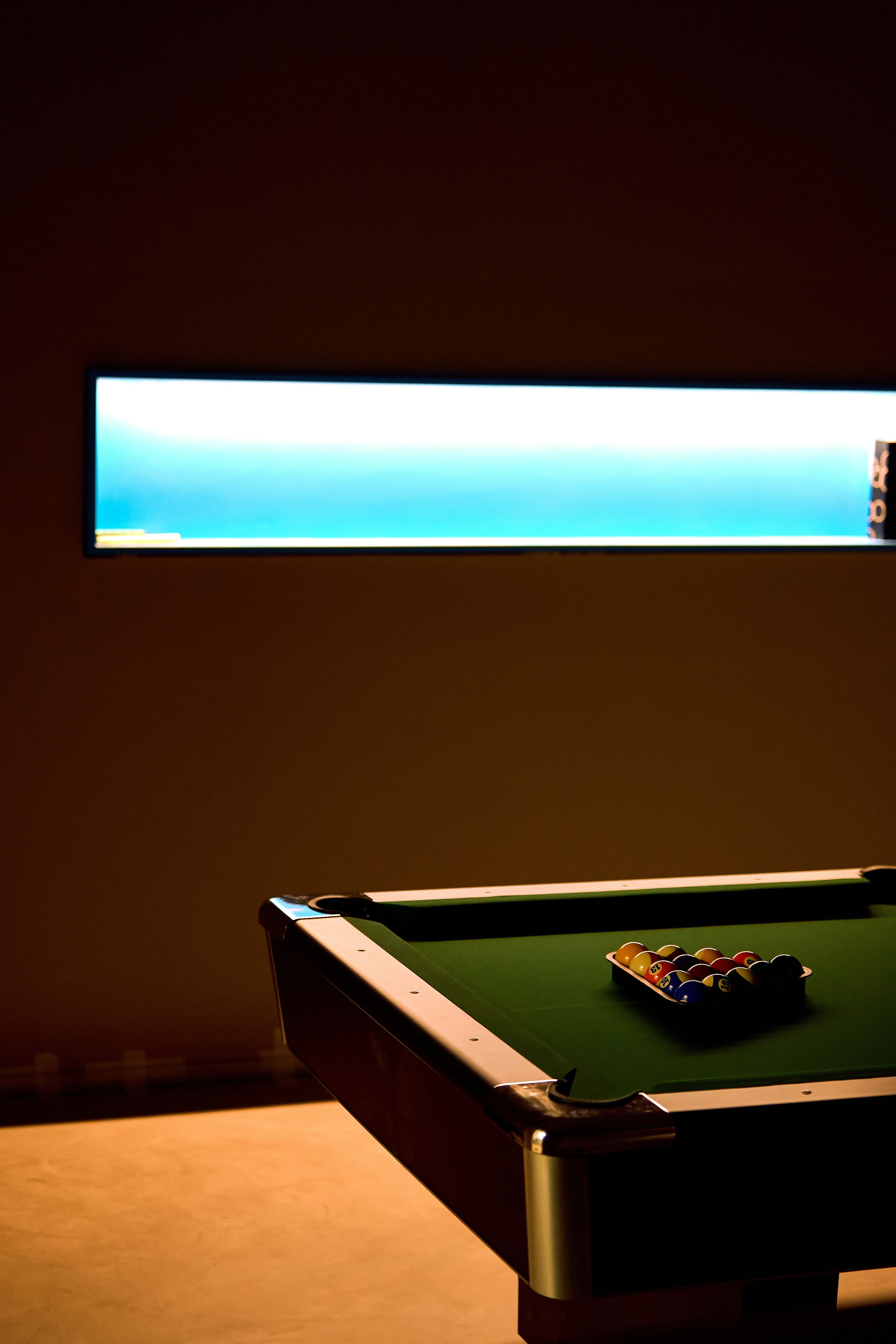 Pool Table Echoes in a Dim Studio
