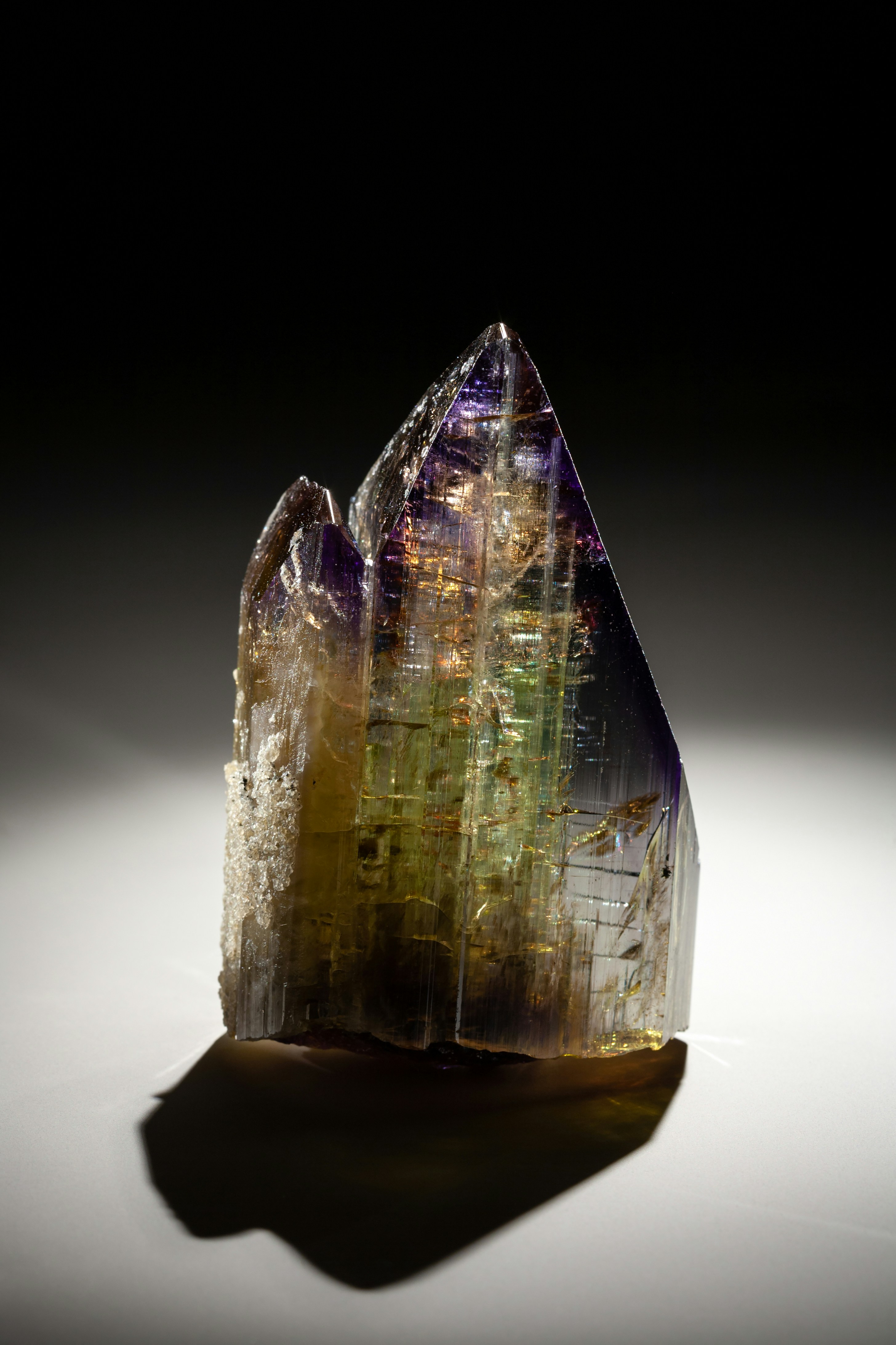 Prismatic Ascendance: a lone crystal rising from shadow