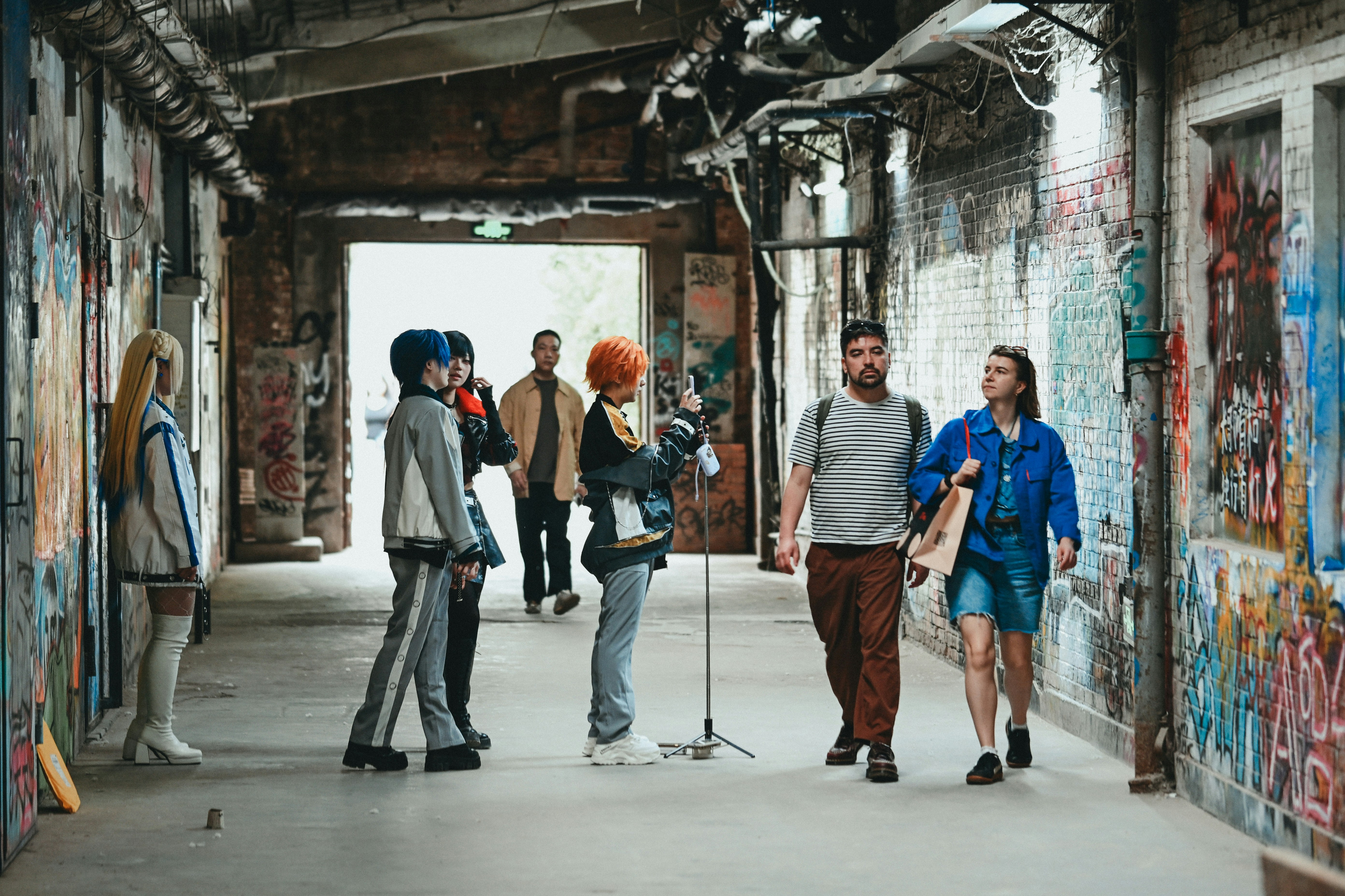 Urban Encounter: The Crew in a Graffitied Passage