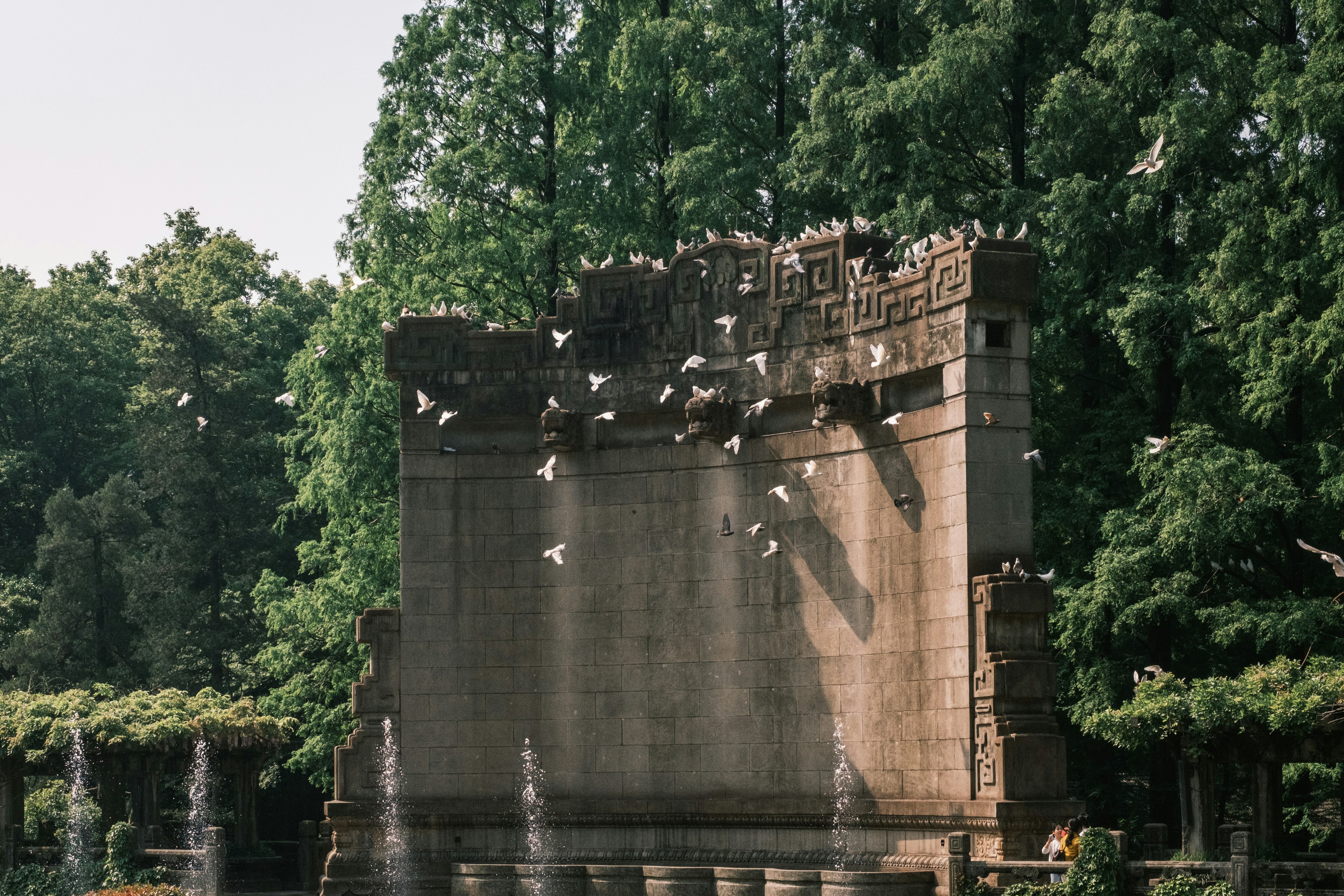 Stone Monolith with Doves: A Quiet Memorial in the Park
