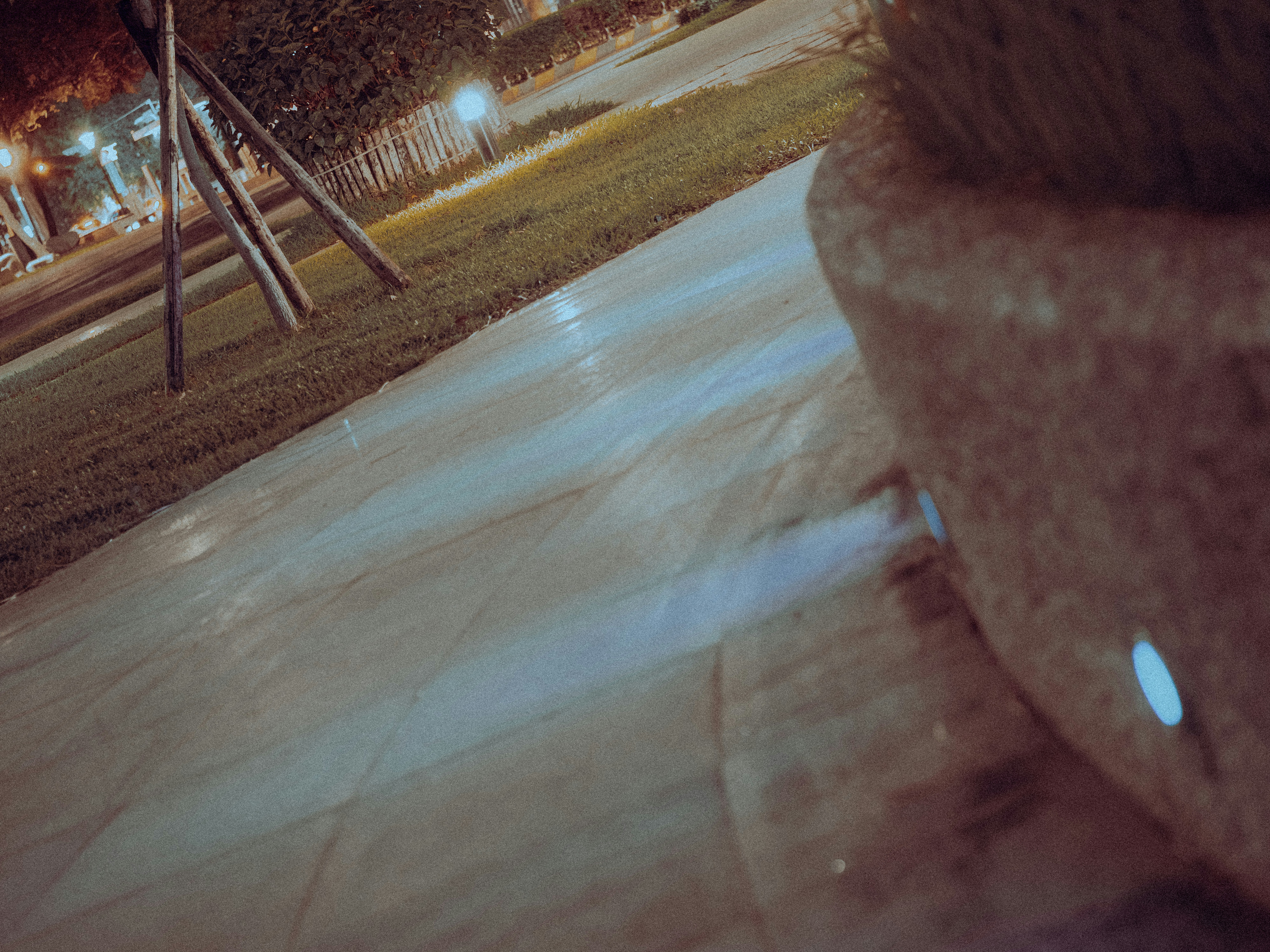 Moonlit Curve: Night Walk Along a Sloped Park Path