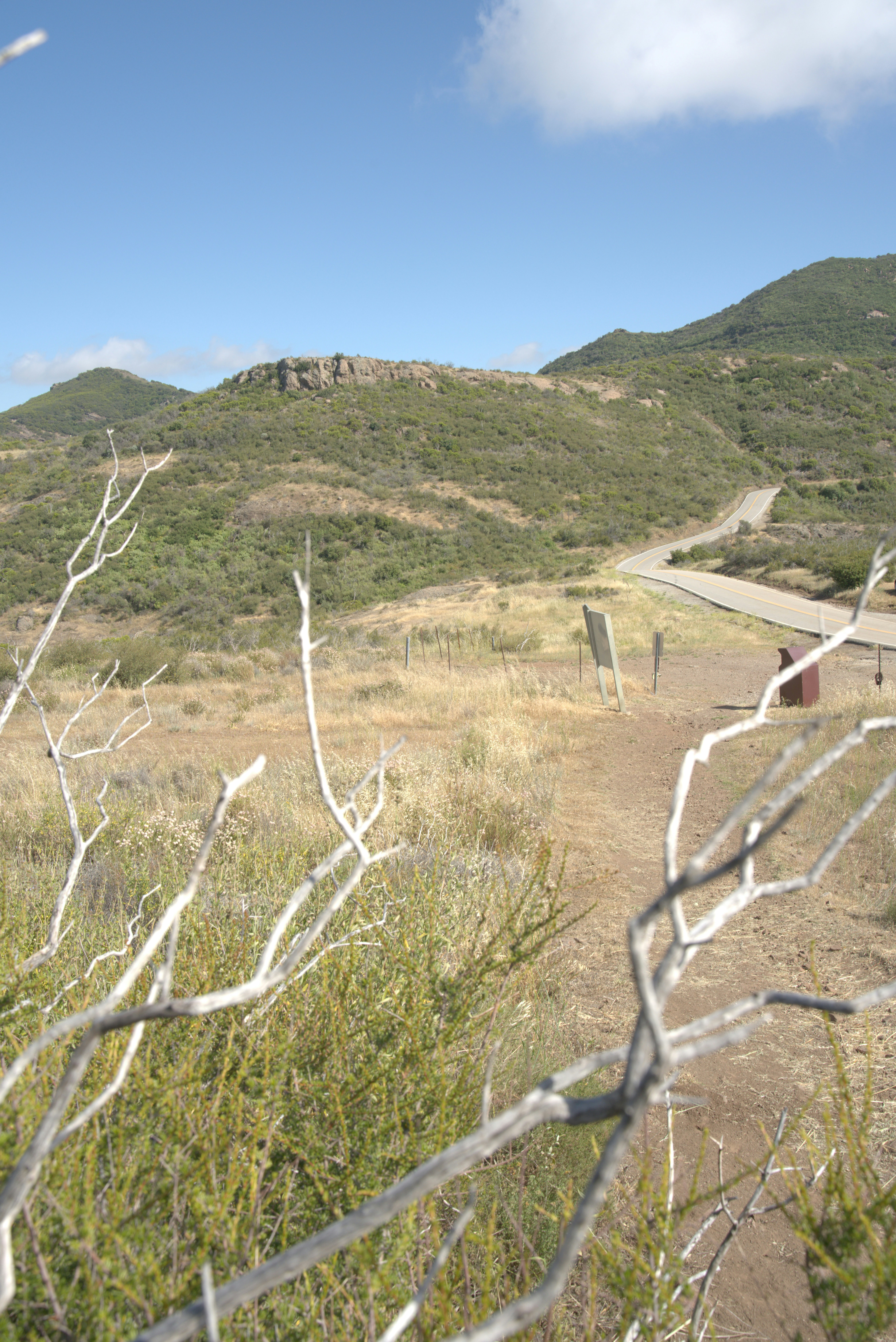Dusty Trail Toward the Distant Hills