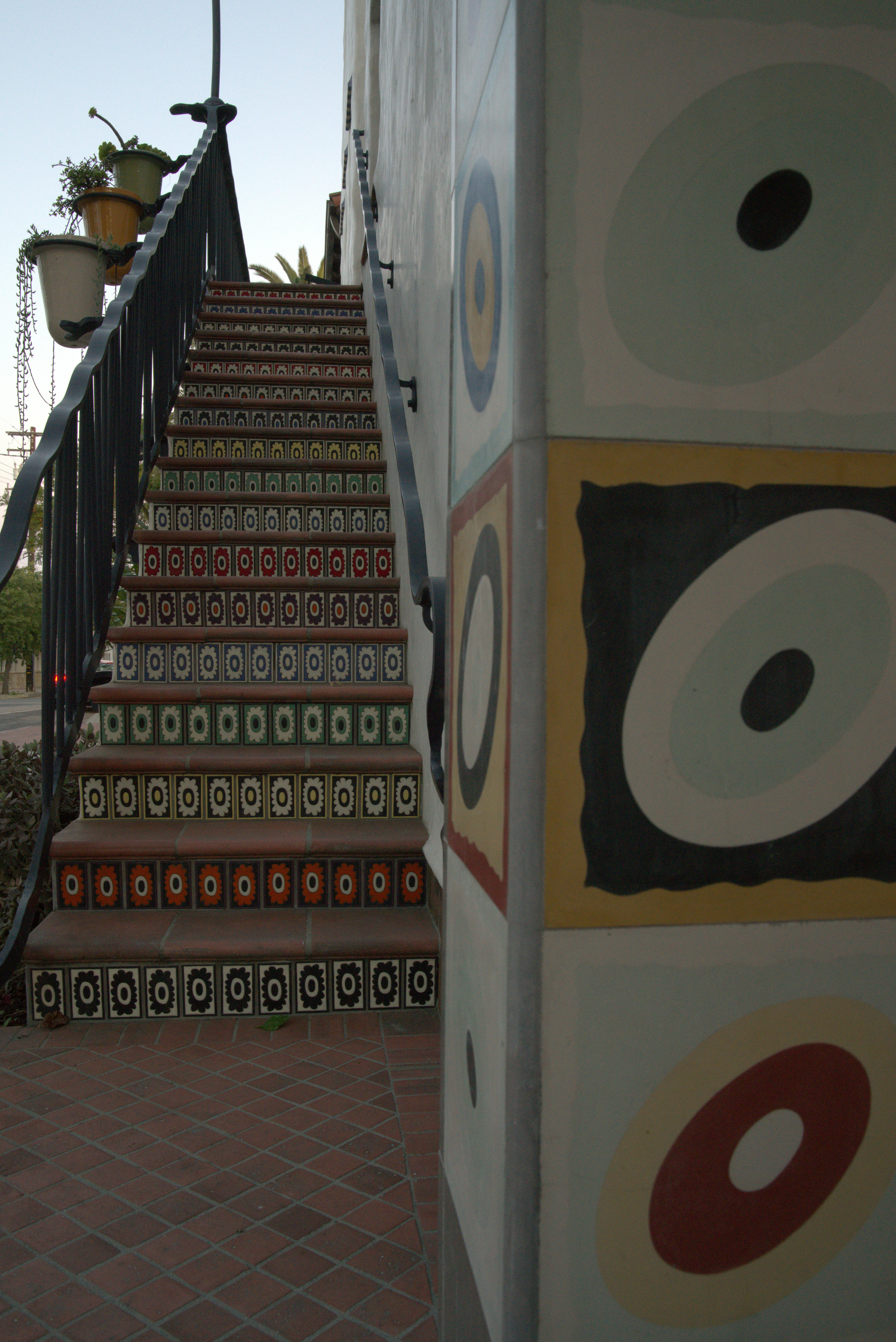 Staircase with decorative tiles and painted wall