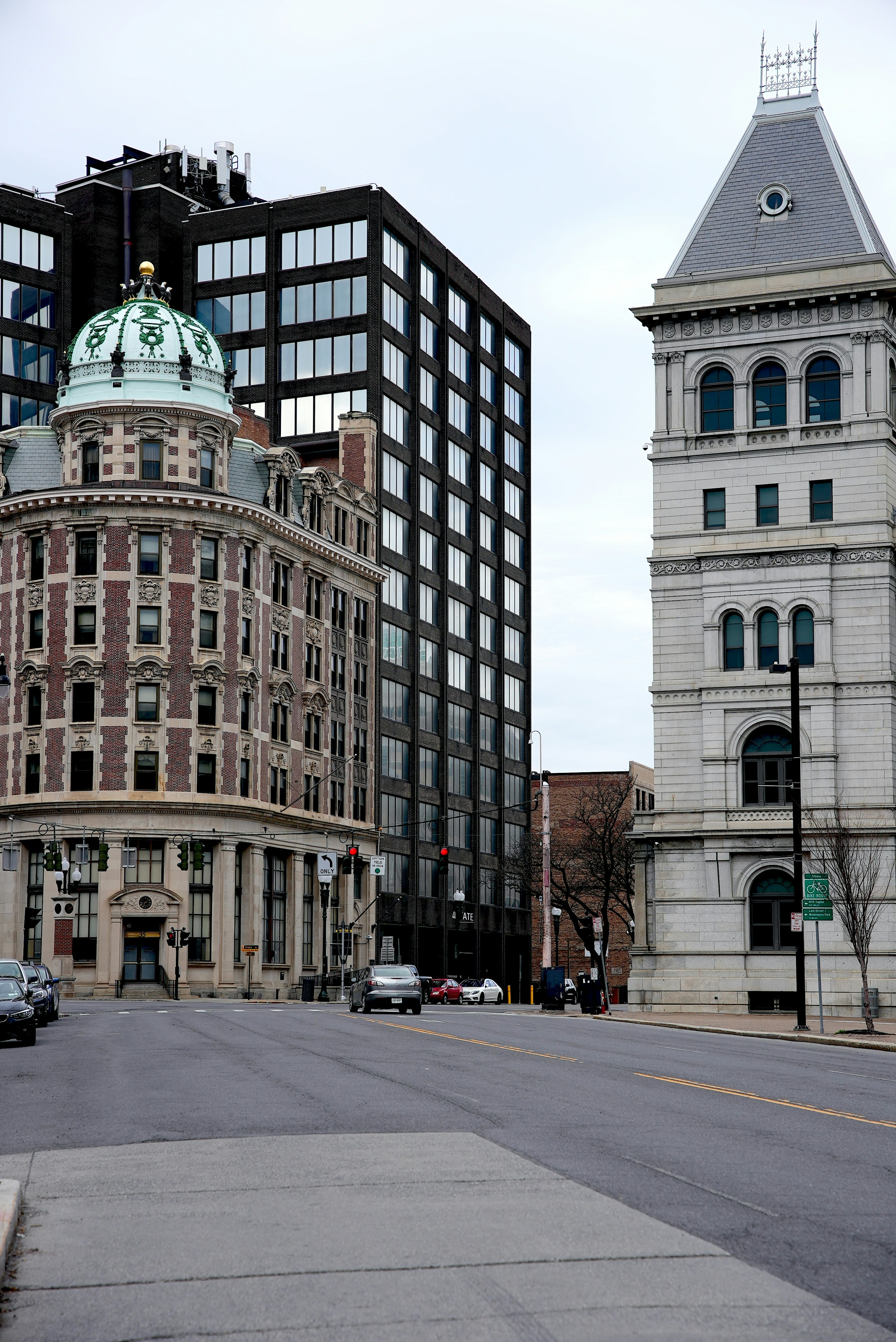 Urban Facades: A Cityscape Framed by Clocktower and Dome