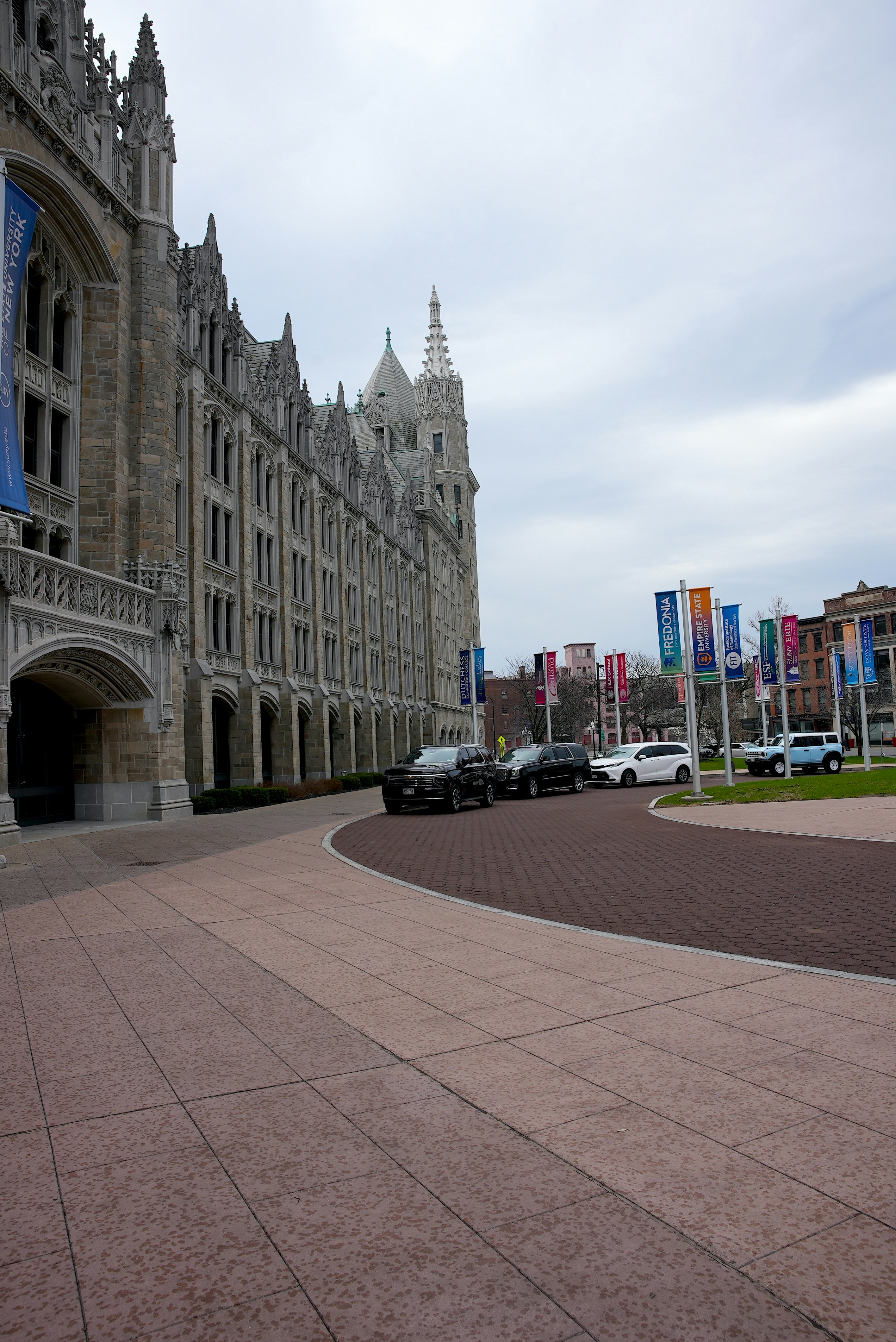Stately Gothic Facade Framing a Modern Bannered Campus