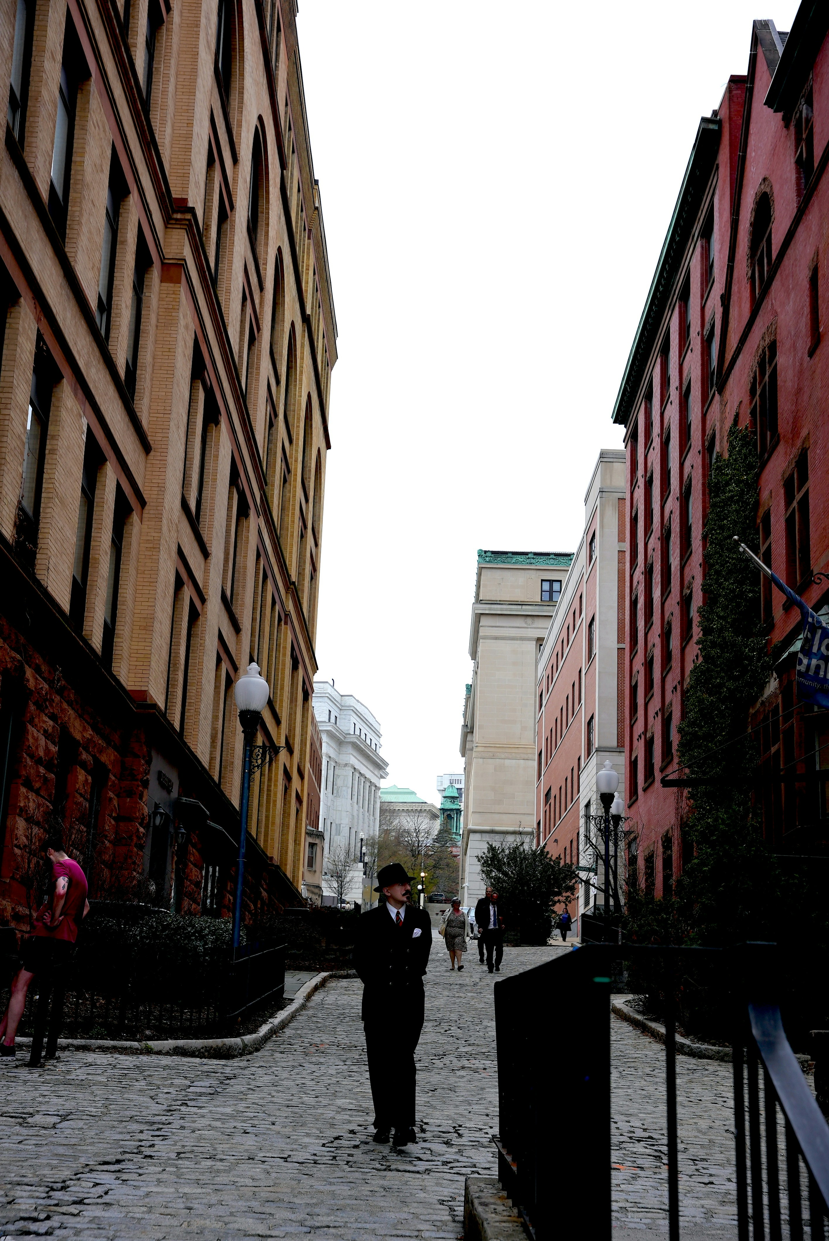 A Narrow Cobbled Way Between Brick Giants