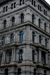 Corner of Time: A Historic Facade Reaching for the Sky