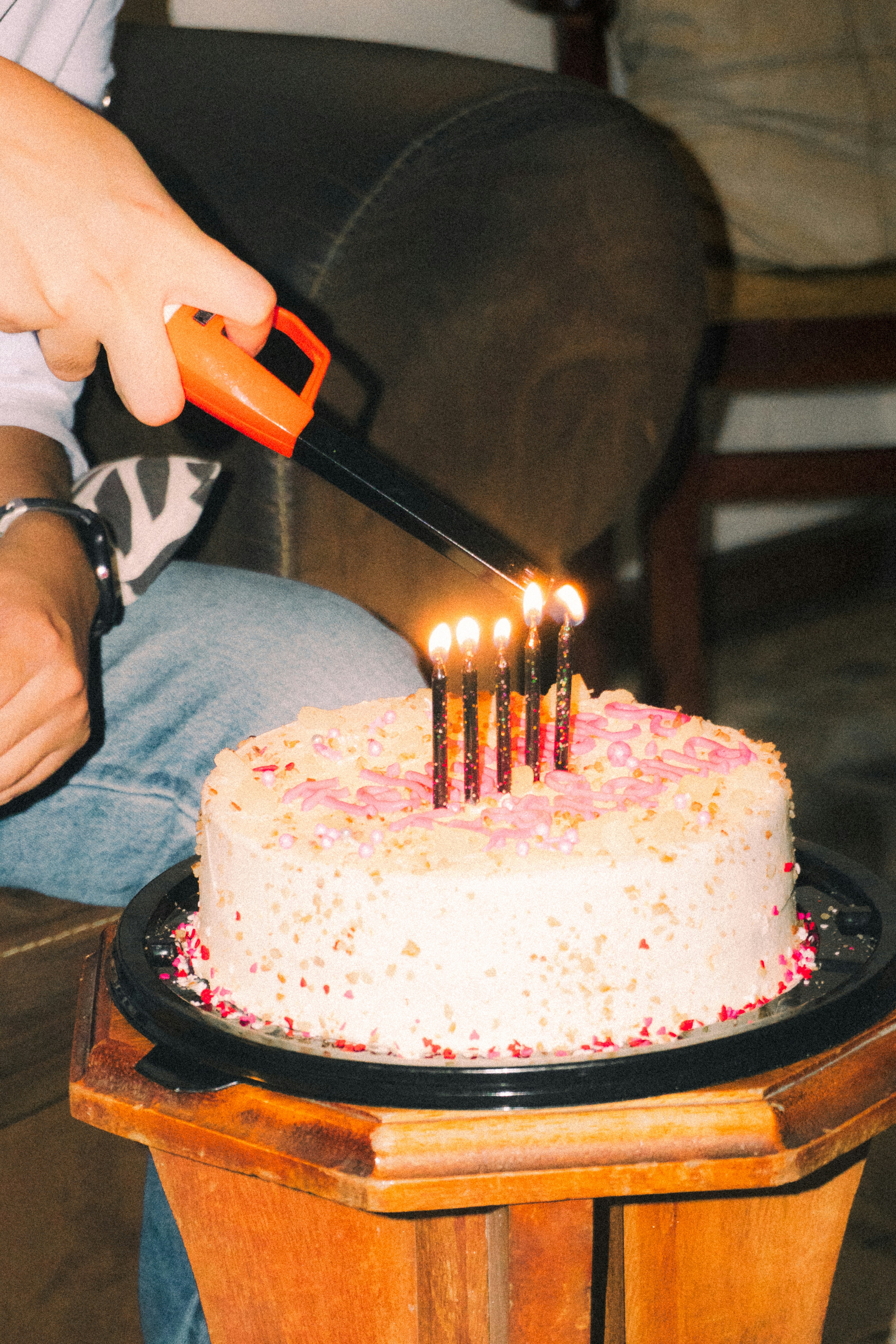 Candlelit Birthday Cascade: The Hand, Flame, and Cake