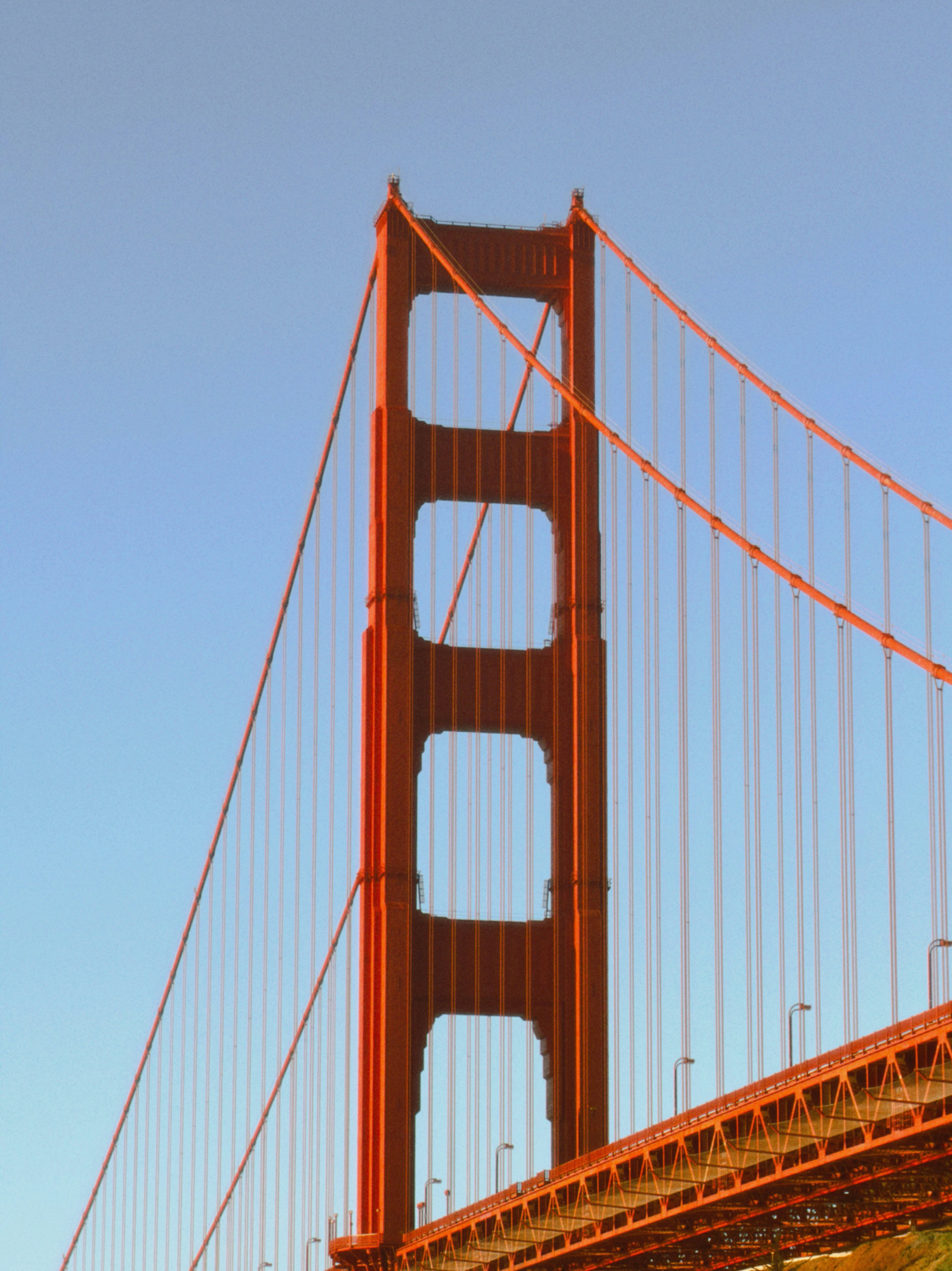 Crimson Spires: The Golden Gate Tower Reaching Toward a Clear Morning
