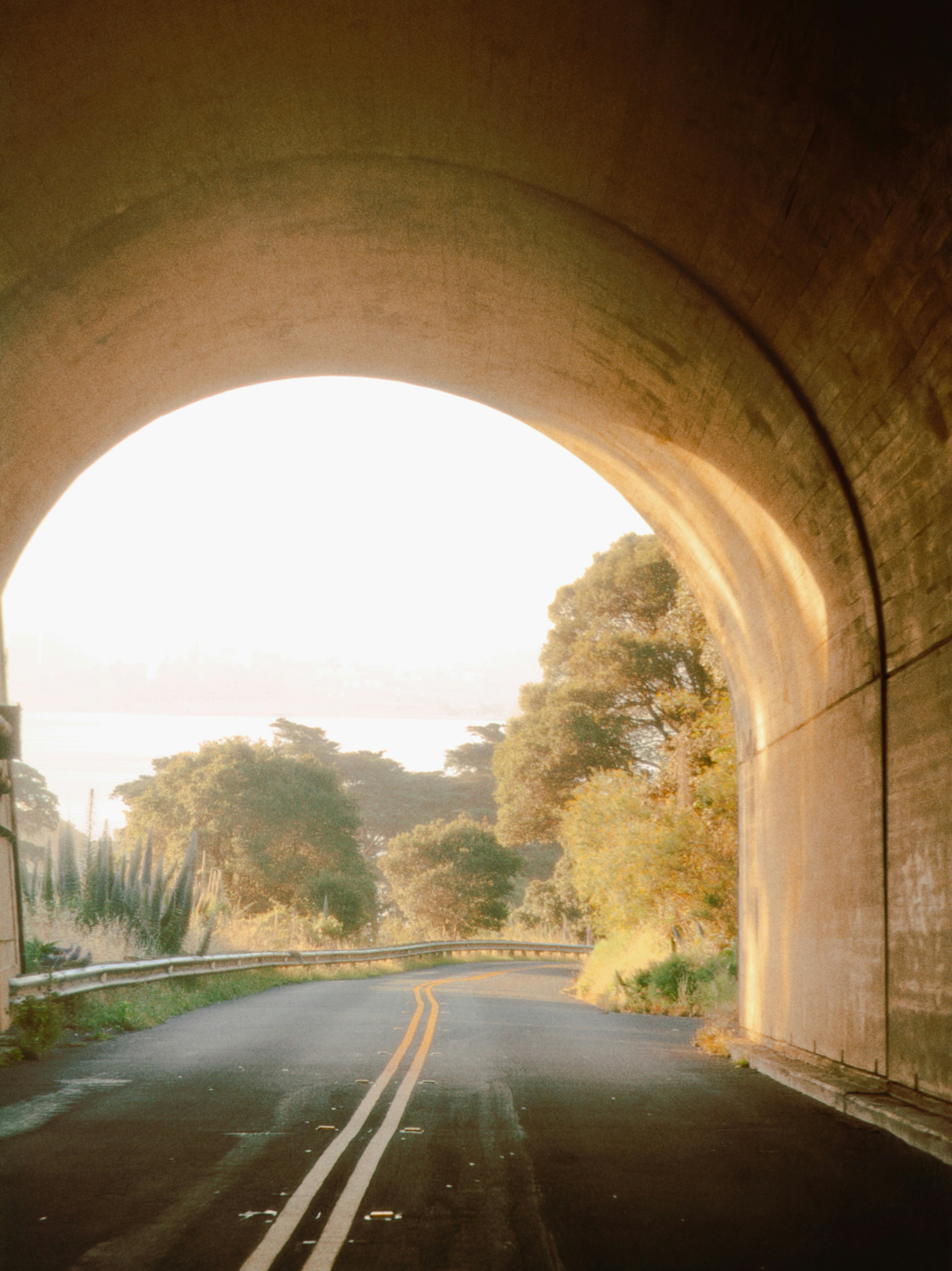 Tunnel Opening: Morning Light on the Winding Road