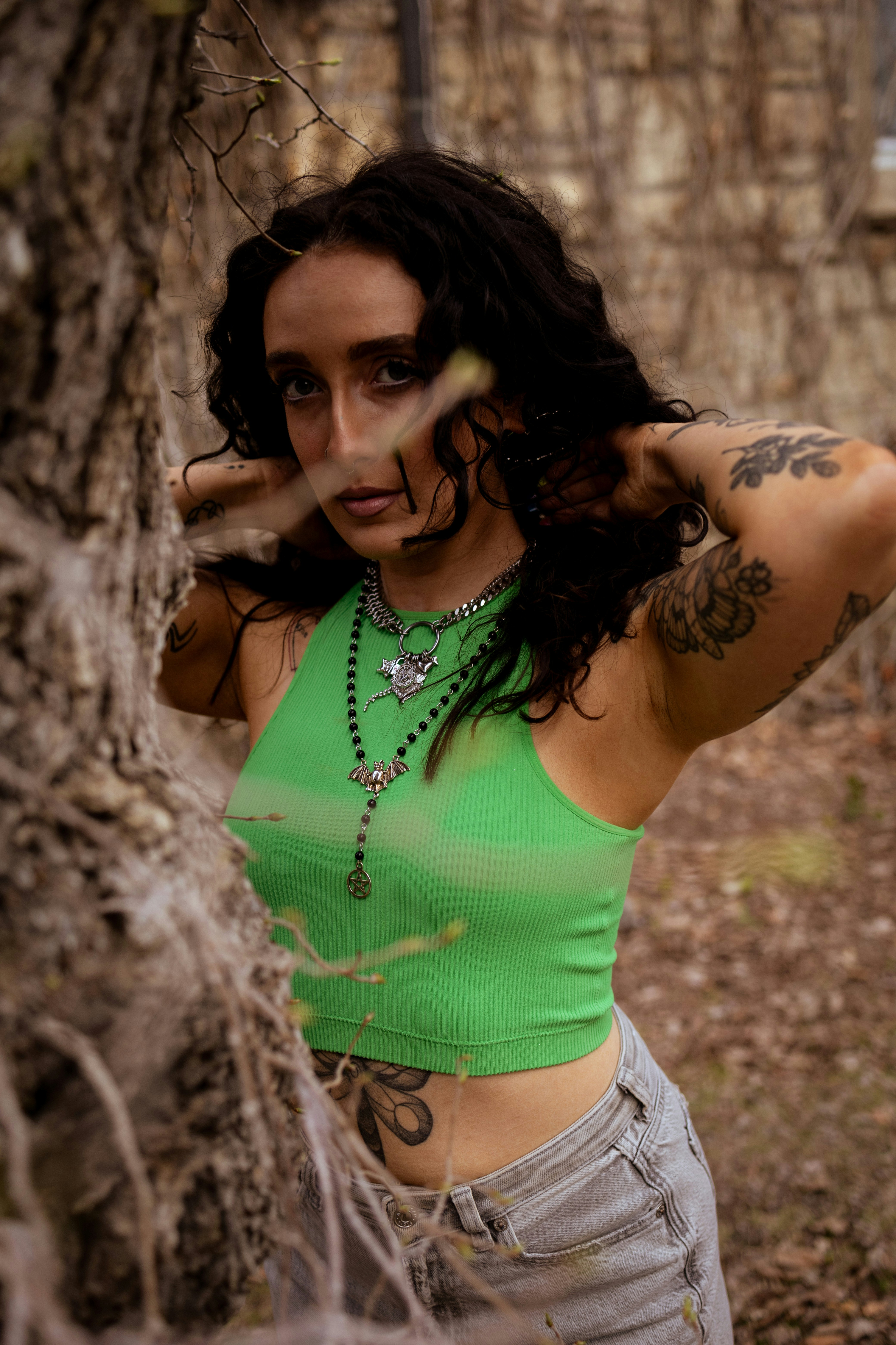 Green Top, Black Ink: A Portrait Amid Rustic Bark