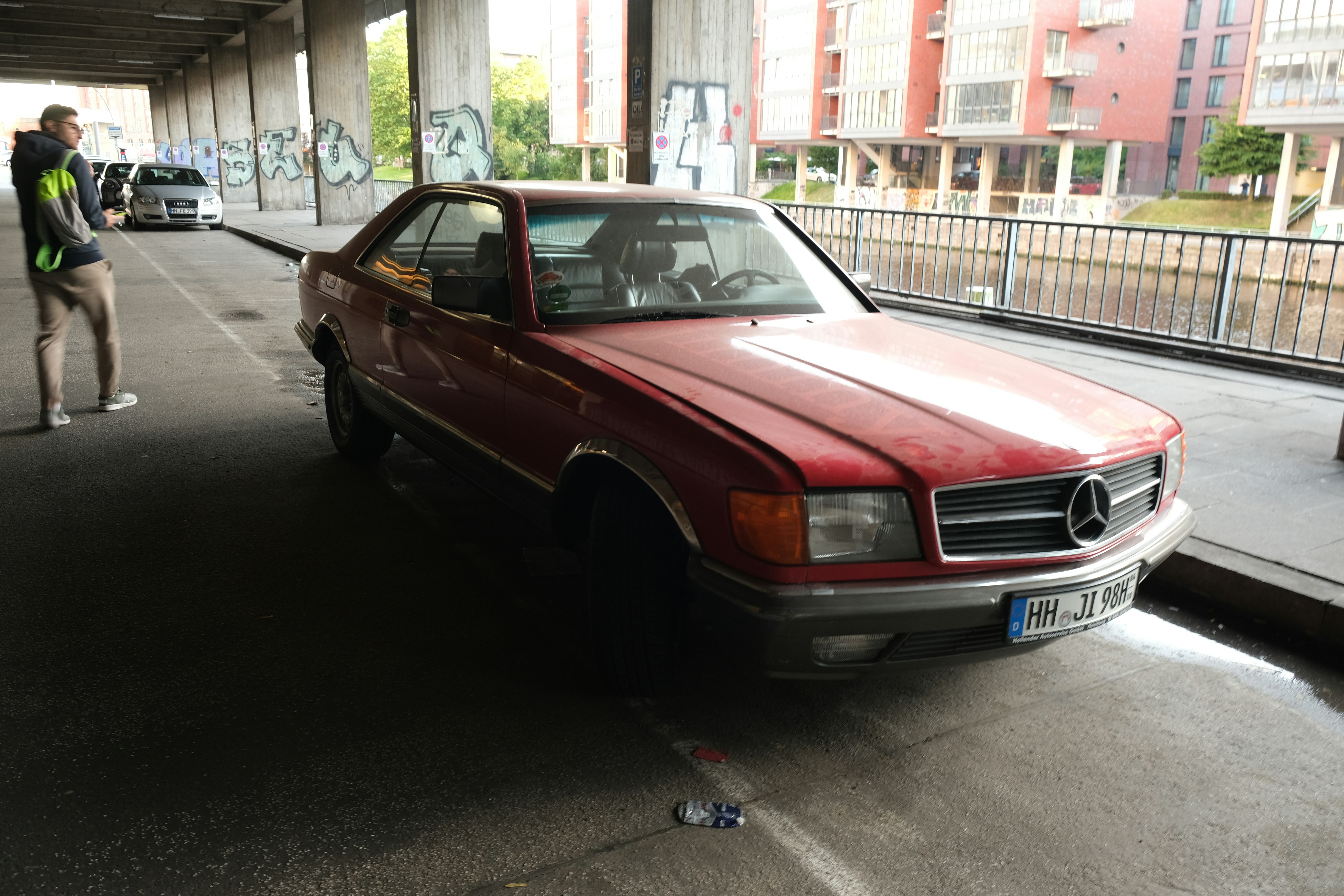 Red Mercedes underpass: beguiling nostalgia with urban graffiti backdrop