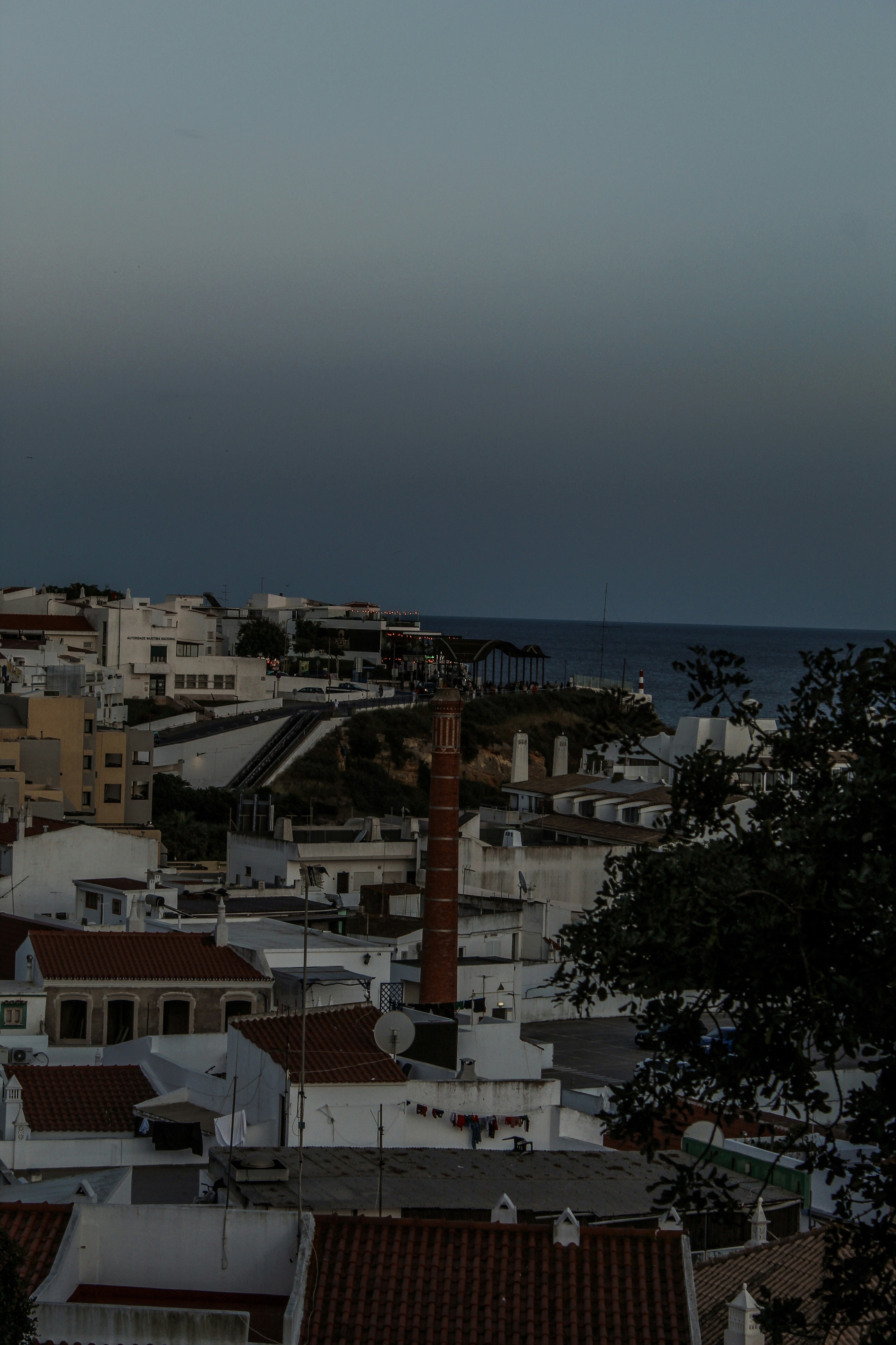 Coastal Town Silhouette Beneath Dusk Sky