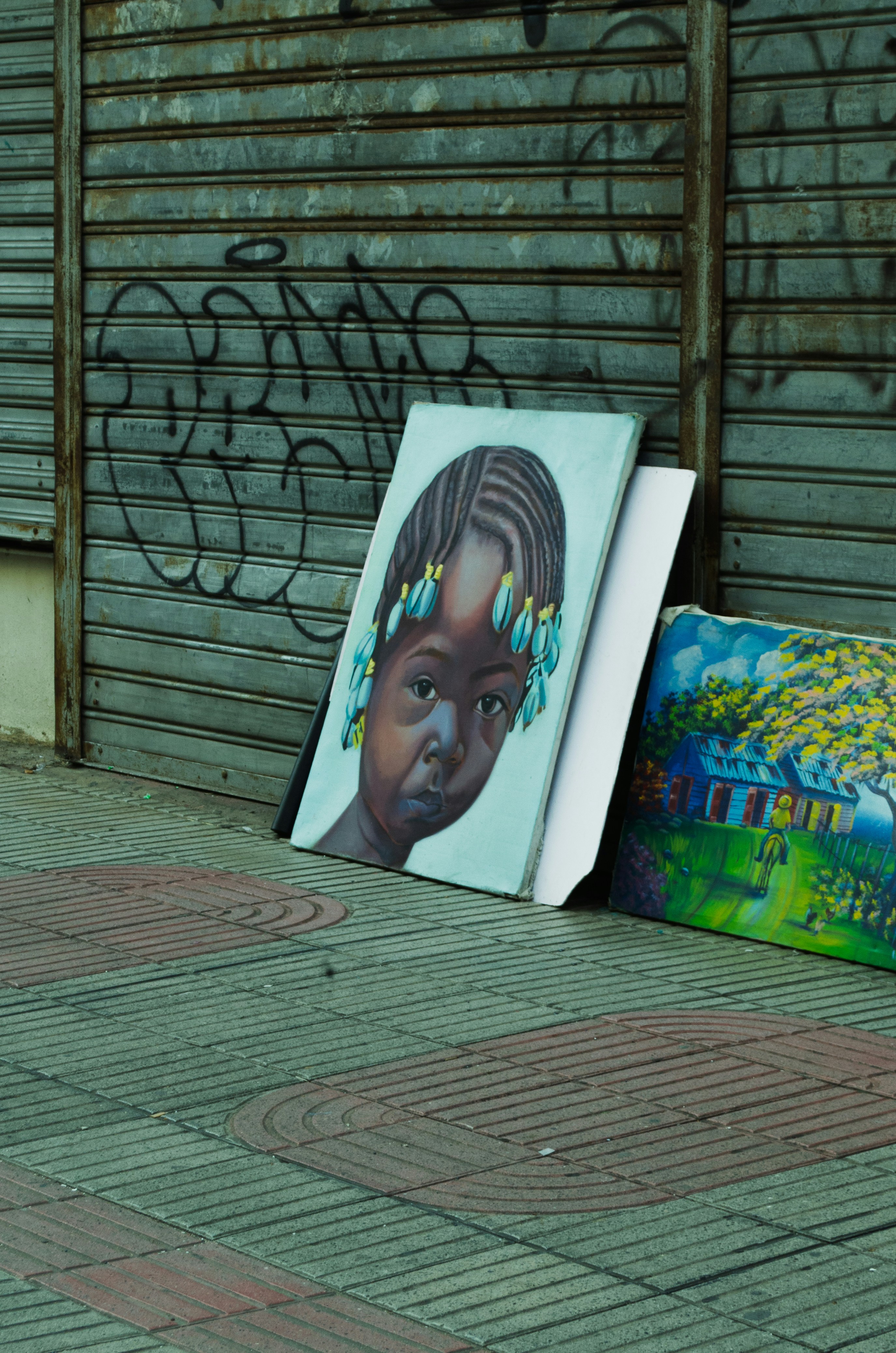Portrait of a Street Canvas: A Child’s Expression Awash in Color