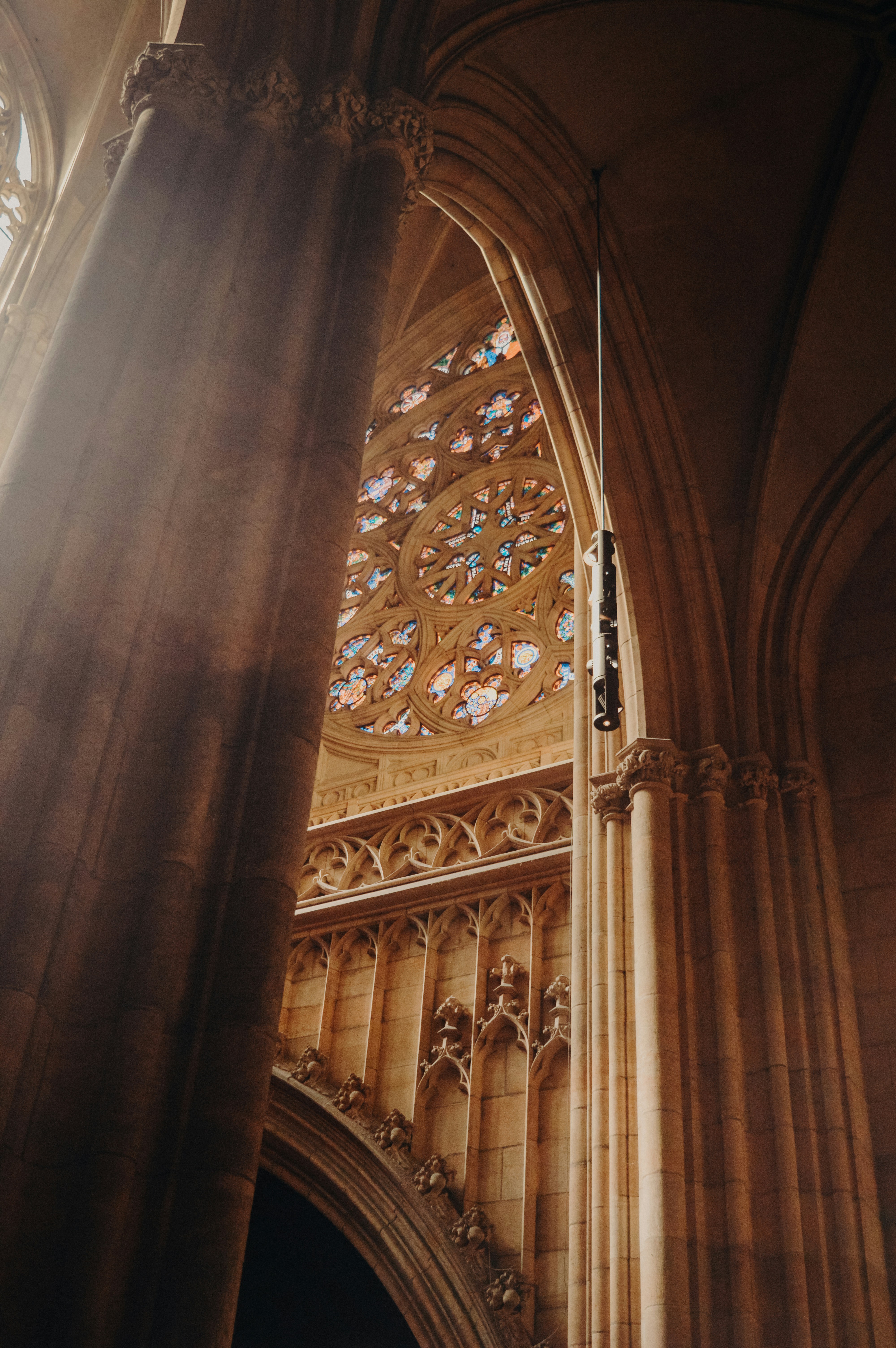 Sunlit Rose Window Framed by Cathedral Arches