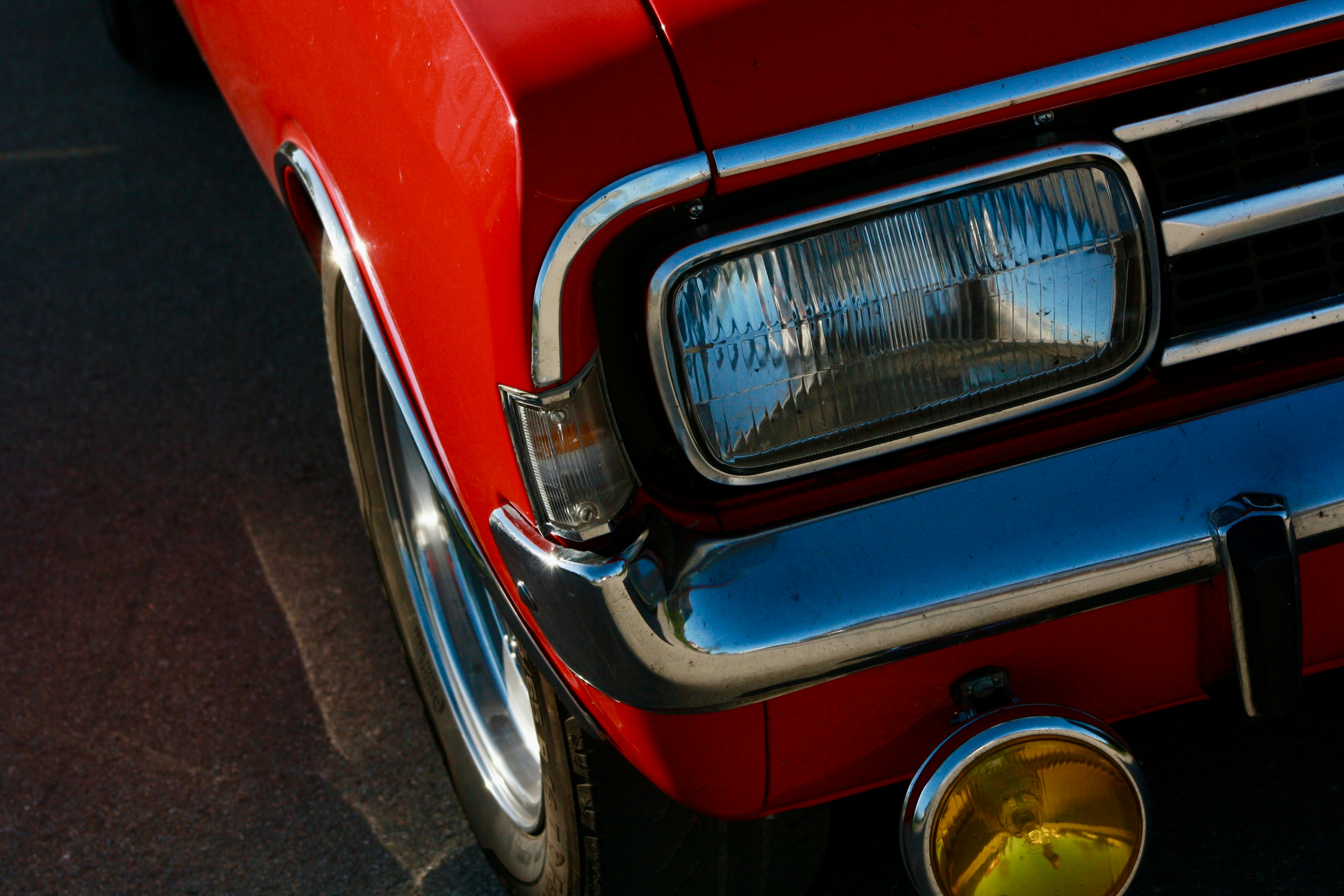 Painted Chrome and Front Edge: A Vintage Red Truck Close-Up