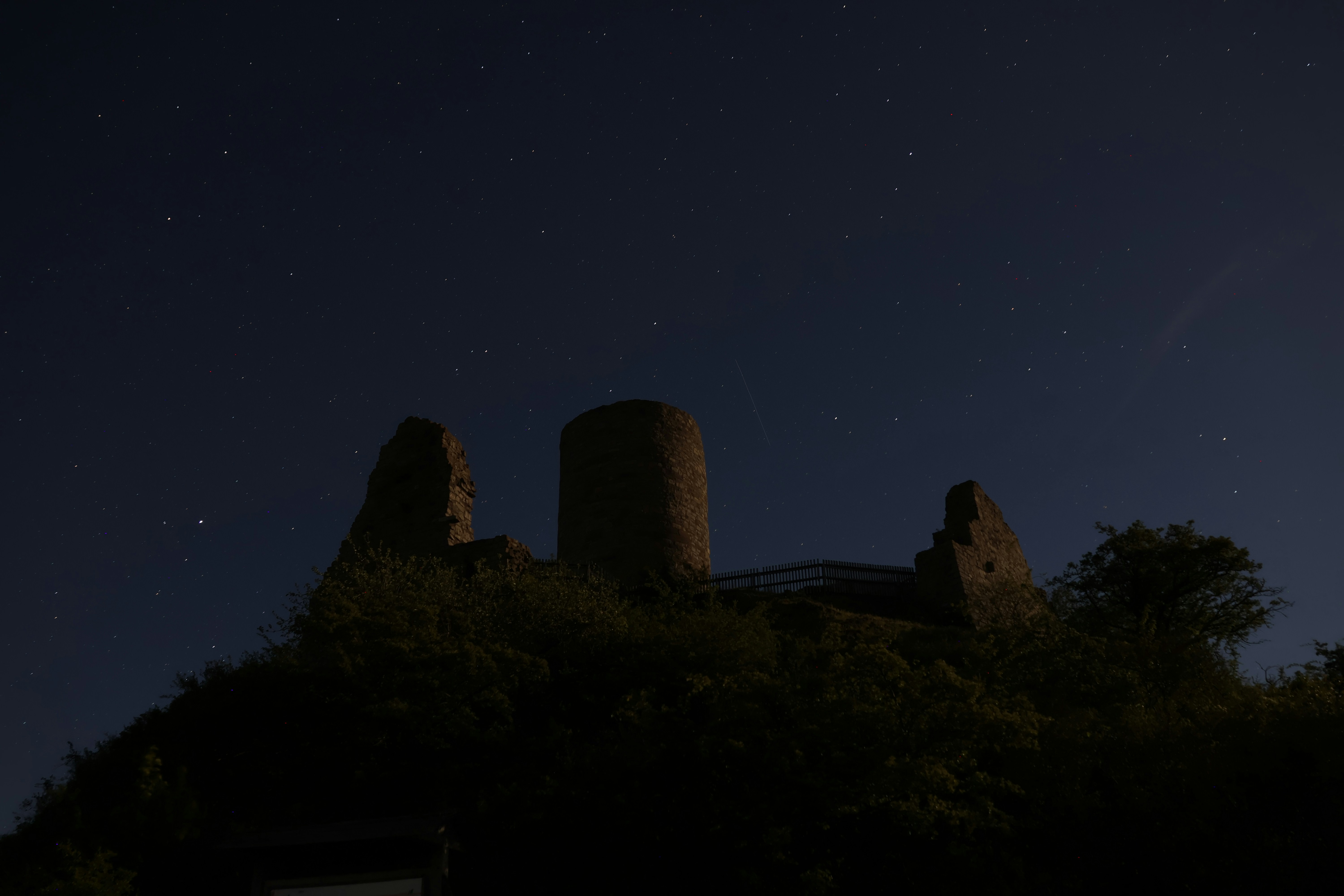 Moonlit Ruins Beneath a Quiet Starfield