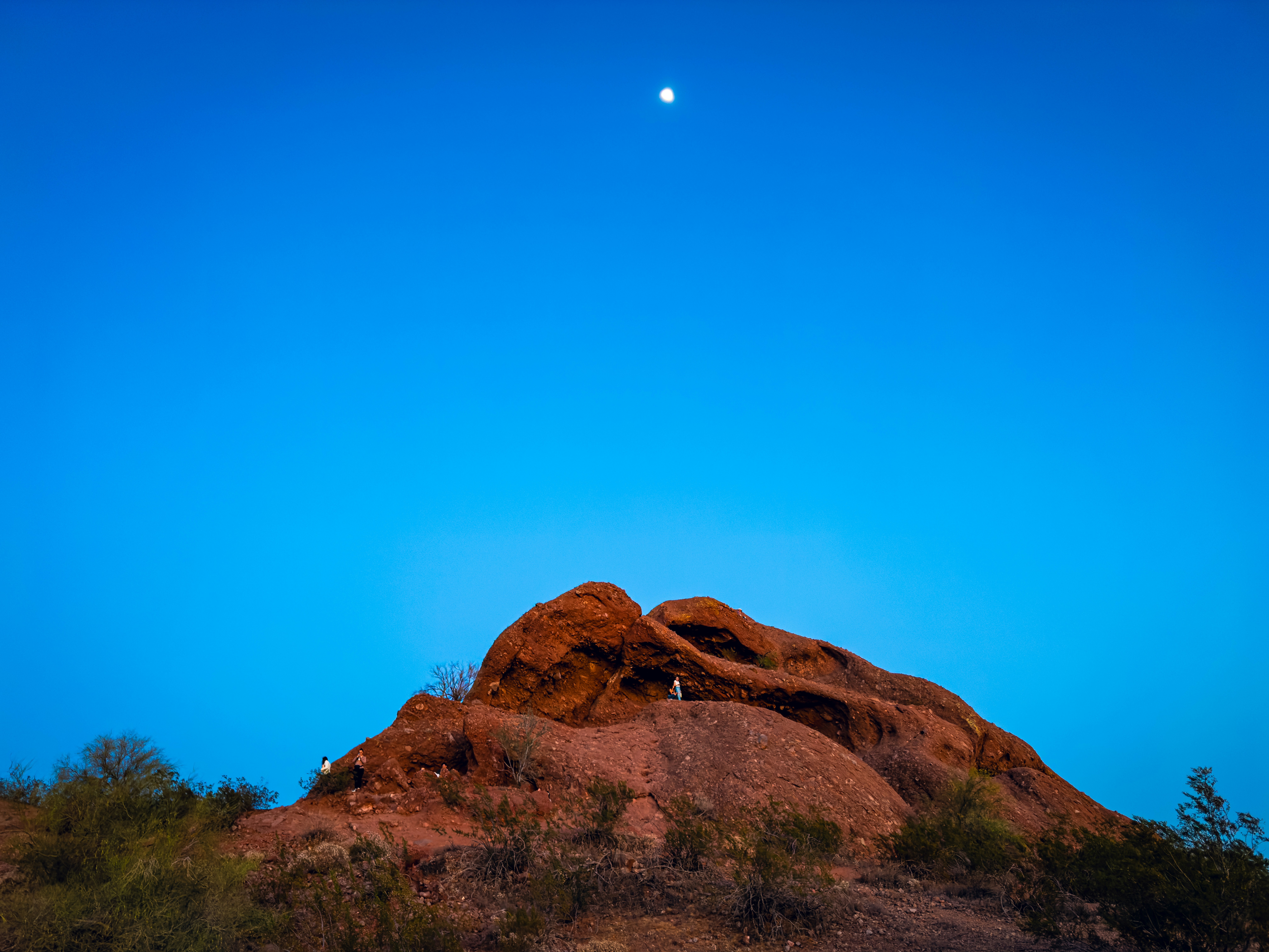 Moon over Desert Volcanic Ridge at Dusk