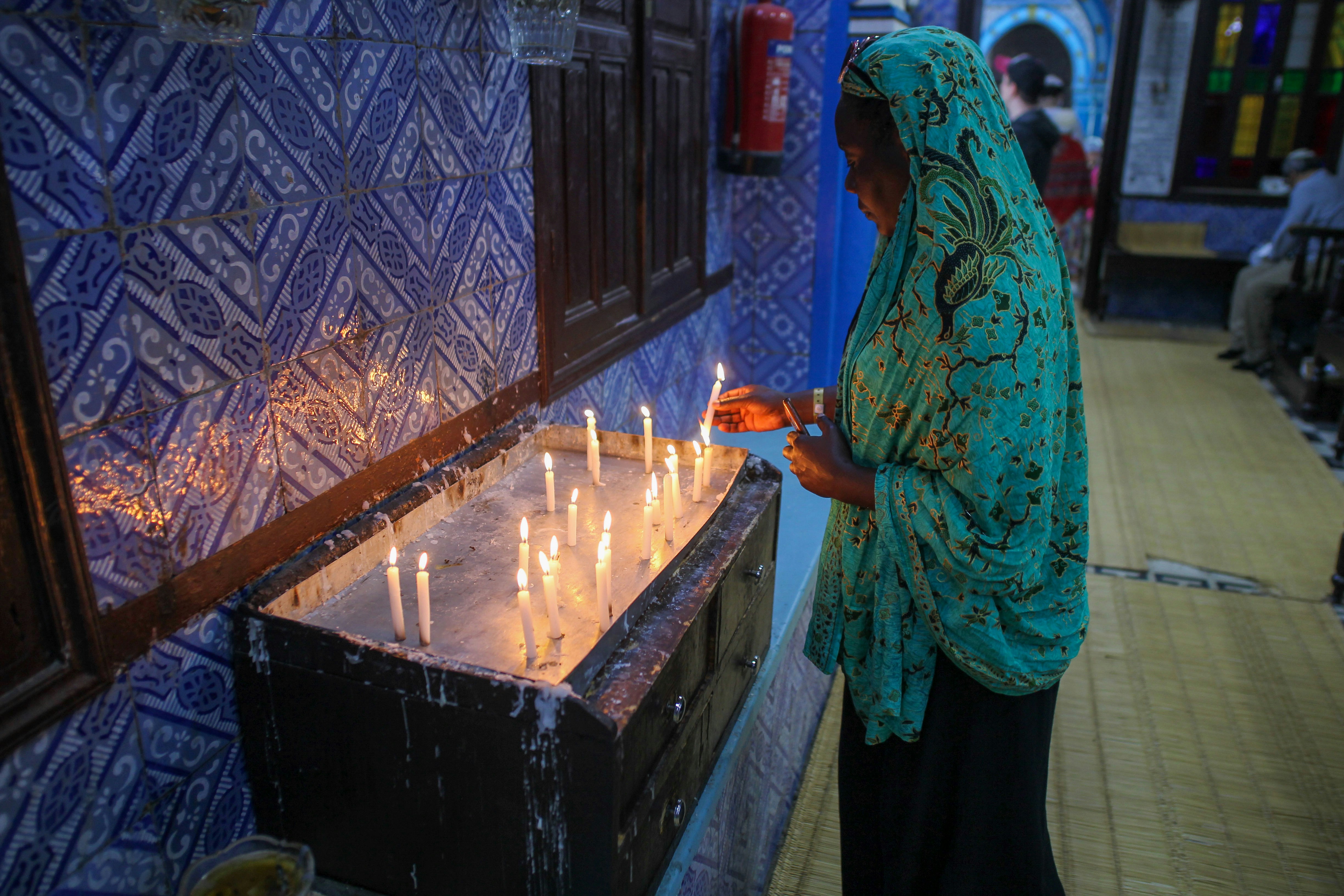 A Jewish pilgrim prays inside the historic Ghriba synagogue in the Tunisian resort island of Djerba, during the annual Jewish pilgrimage on April 30, 2026.