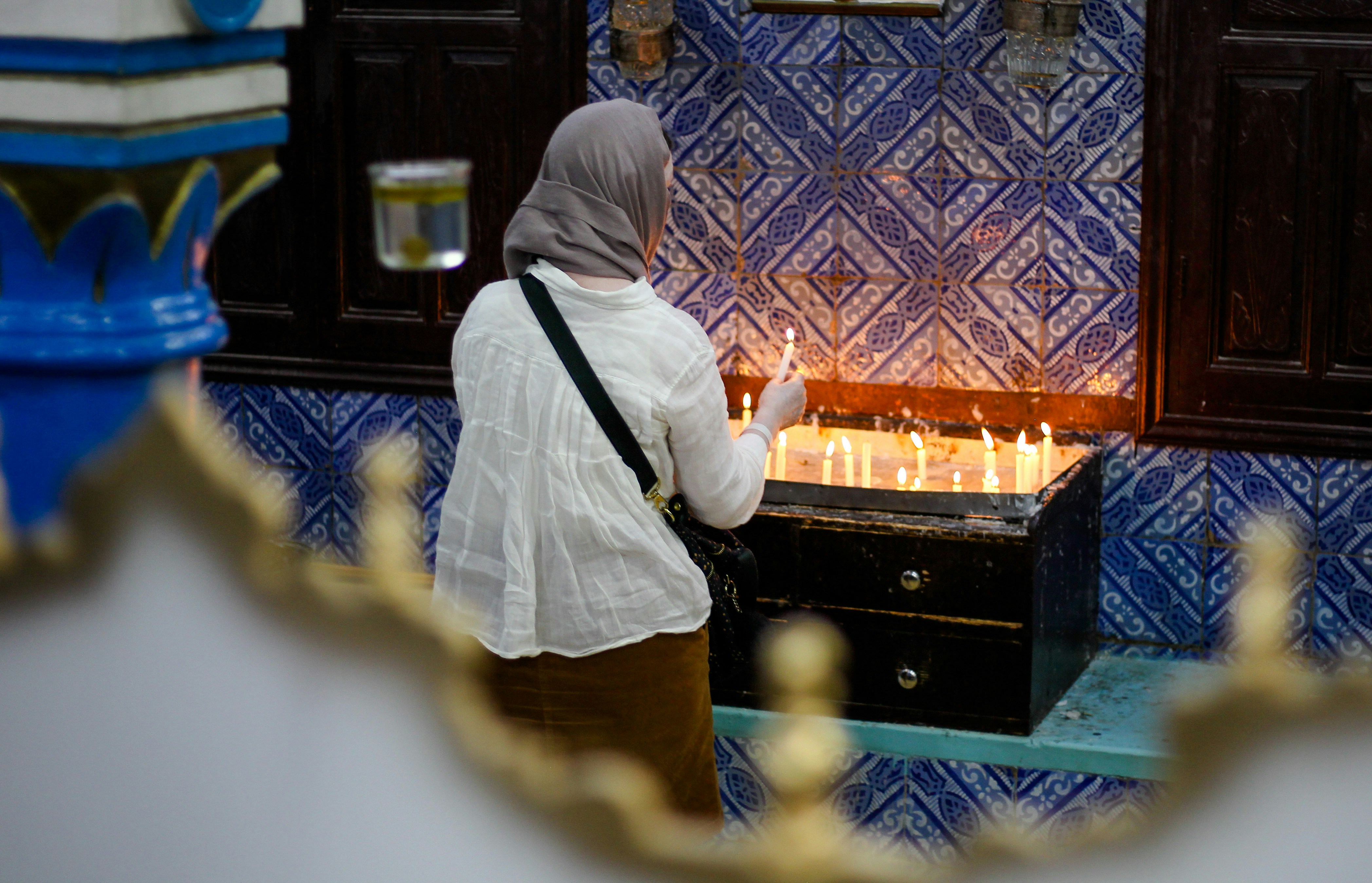 Candles in a Blue-Carved Shrine: A Quiet Offering