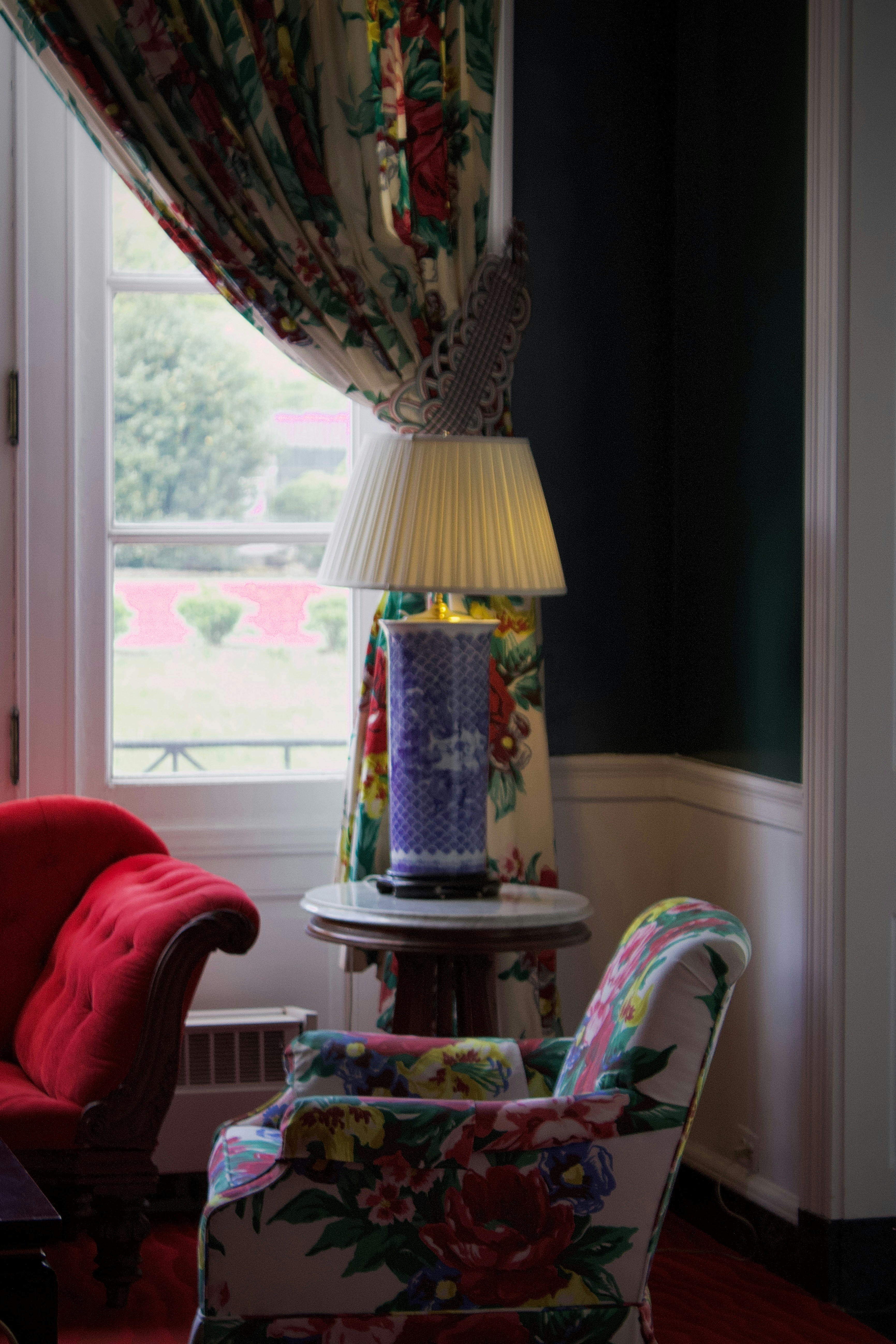 Floral Conversation: A Bold Lamp Between Velvet and Garden light