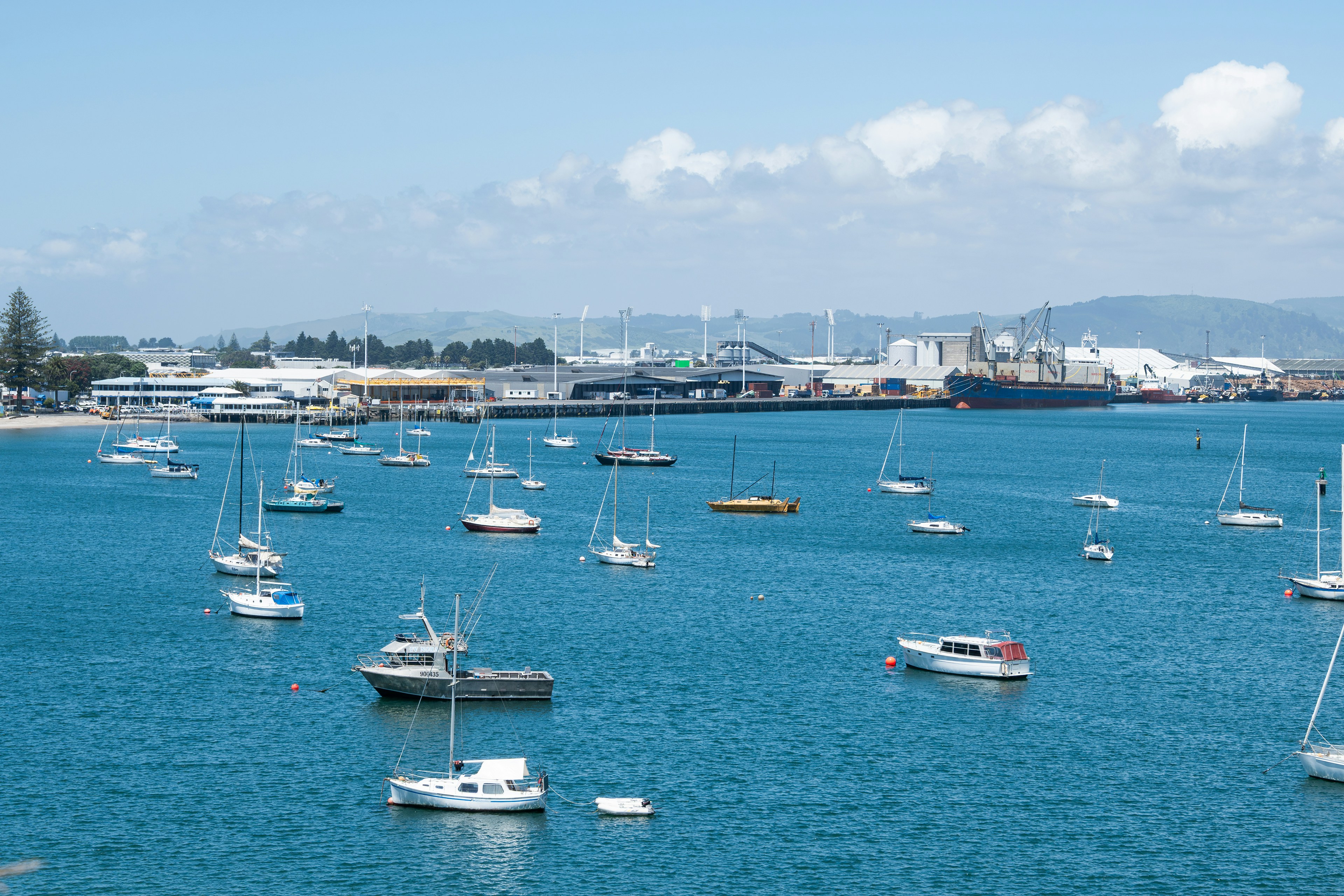 Harbor Mosaic: Boats Rest Under a Wide Blue Sky