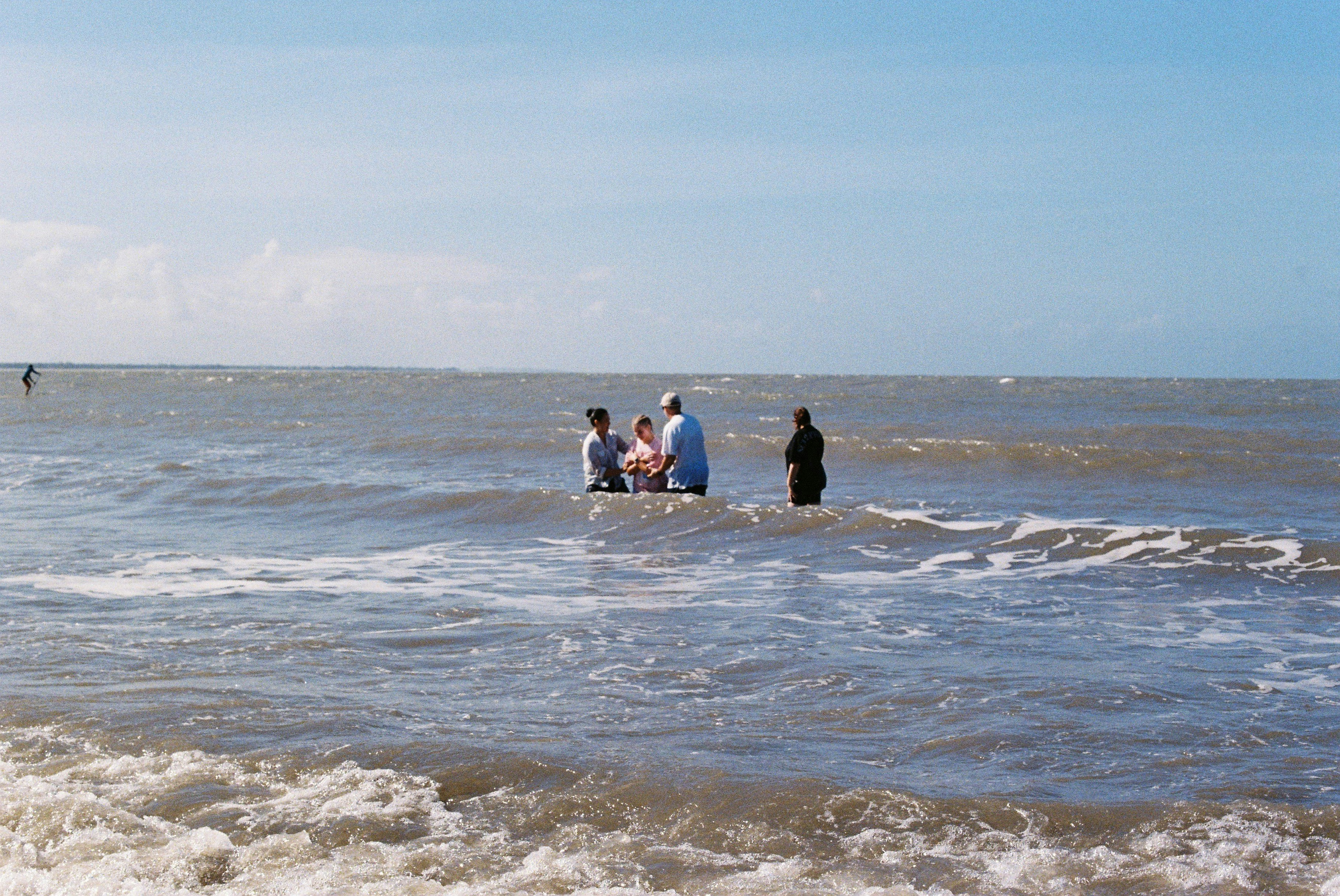 People standing in the ocean water