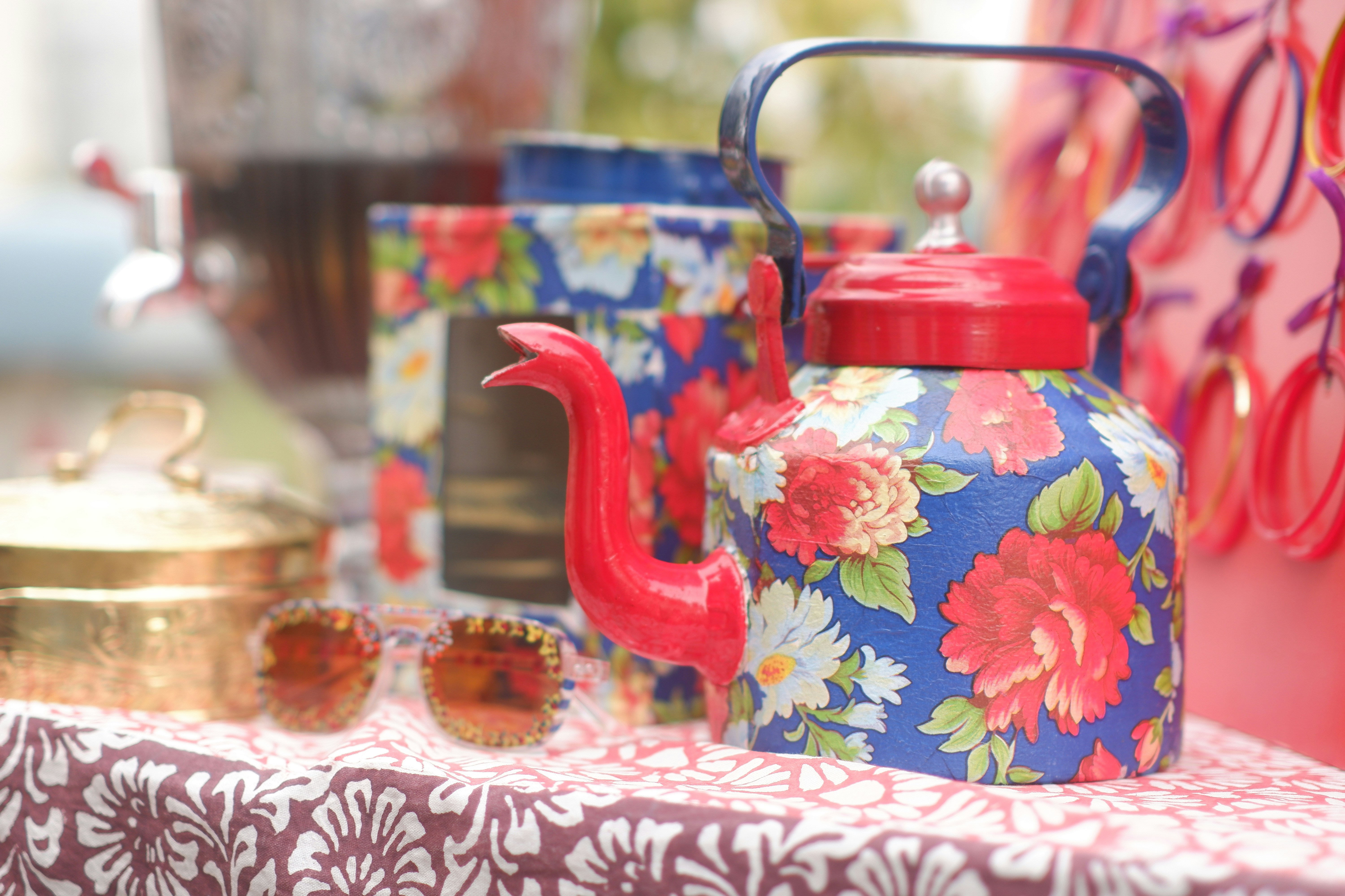 Floral Kettle Ensemble on a Sunlit Market Table