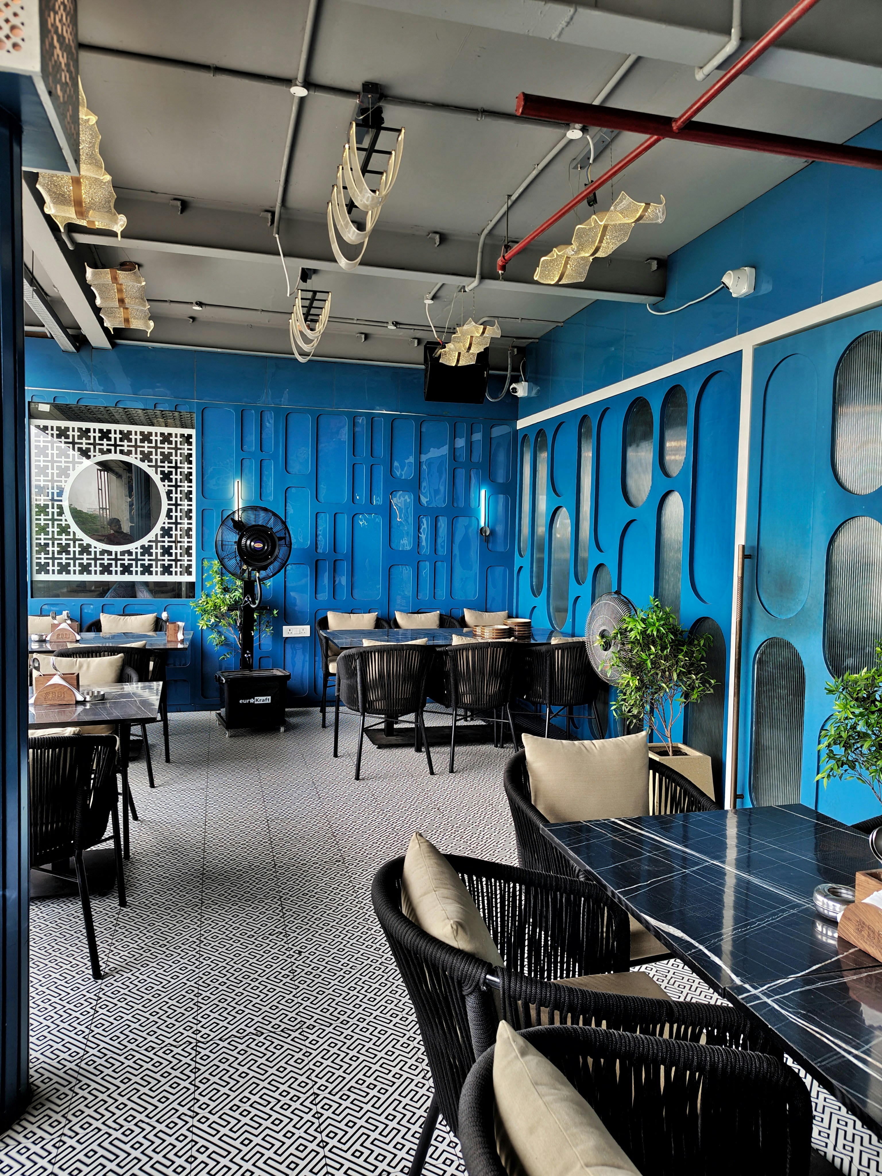 Blue Lounge in Symmetry: A Café Portrait in Saturated Hues