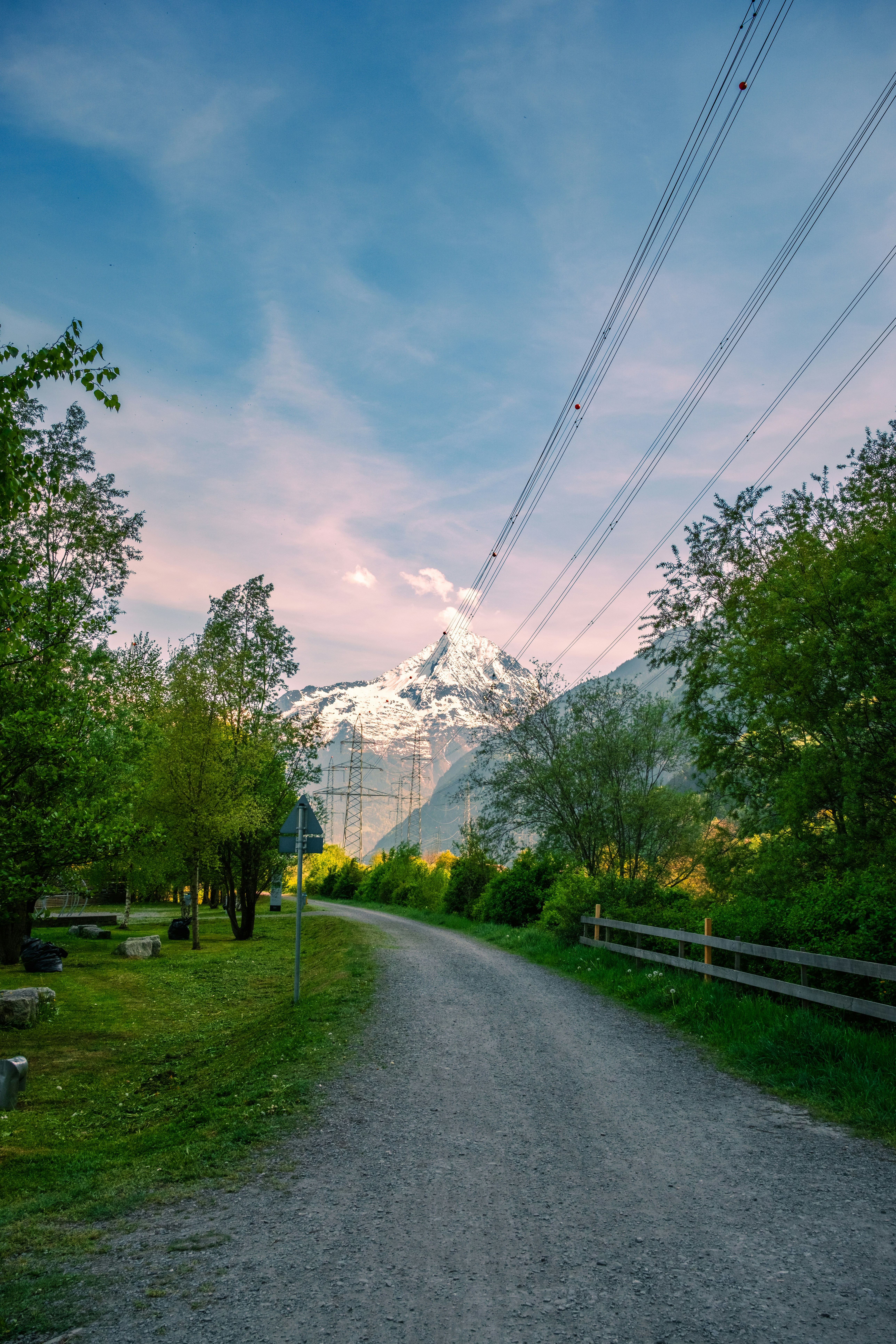 Snow-Capped Peak Above a Rustic Gravel Path
