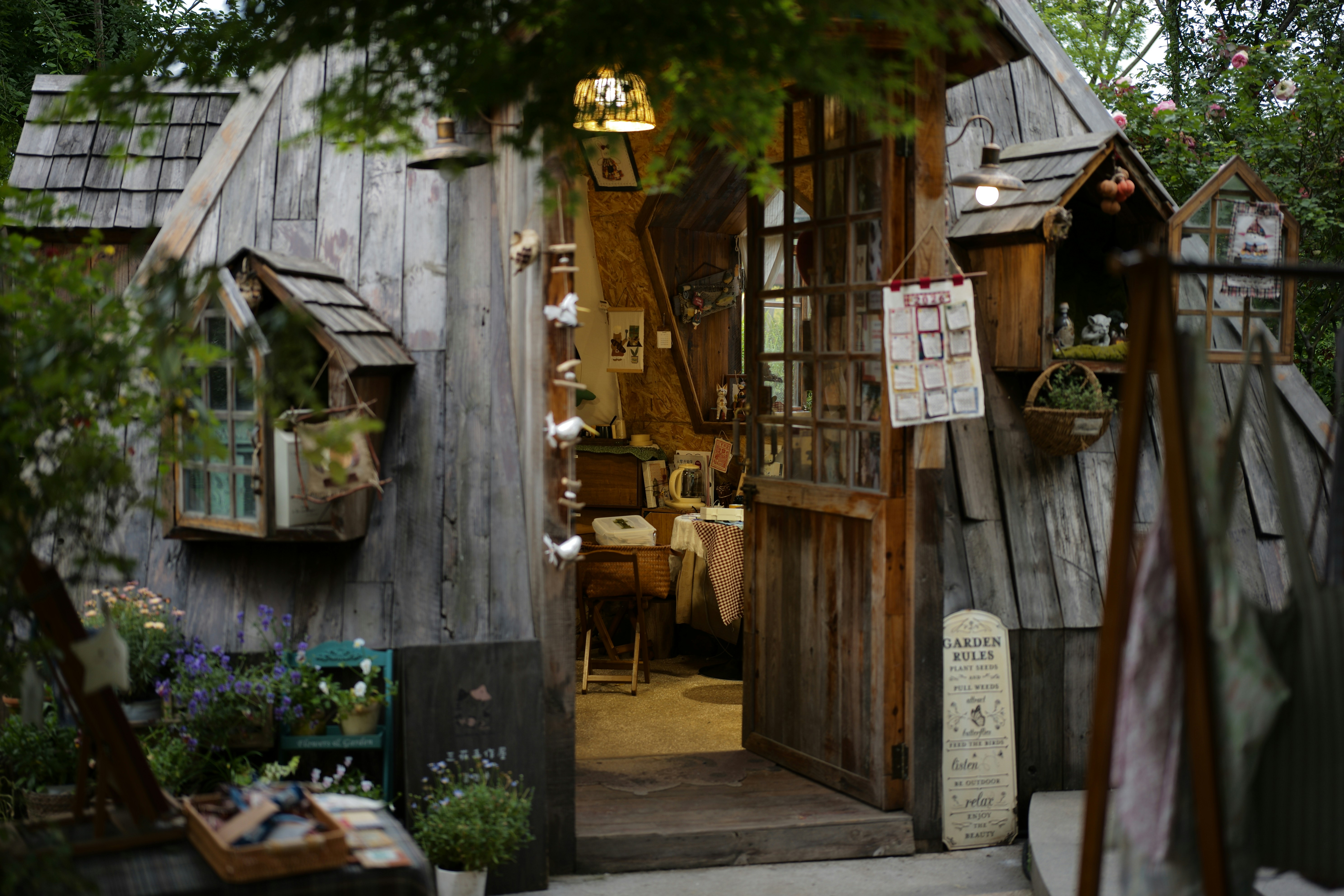 Cozy Workshop Doorway: A Rustic Market Café Hidden in Wooden Shingles