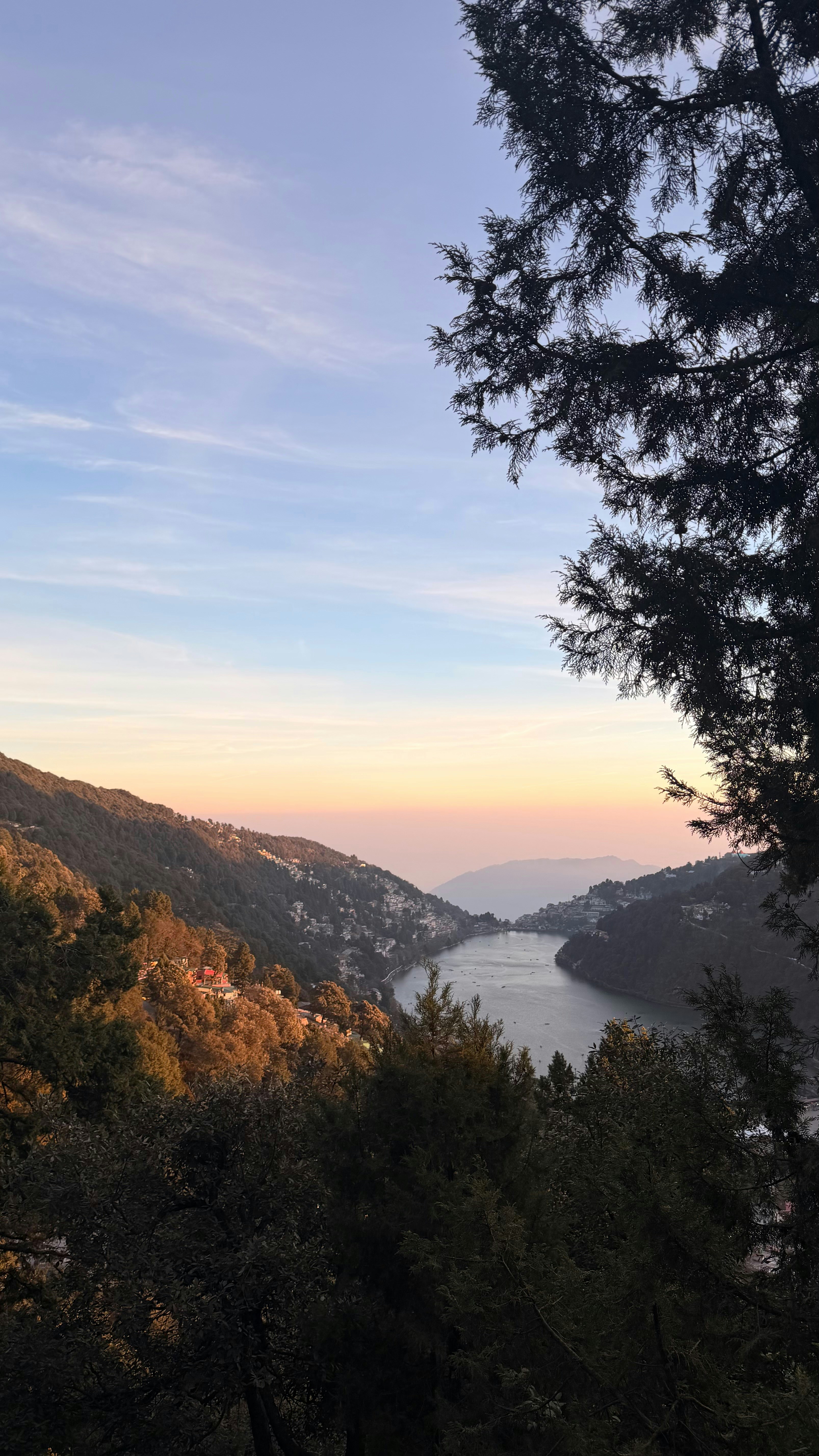 Sunlit Gorge: River Between Embracing Valleys at Dusk
