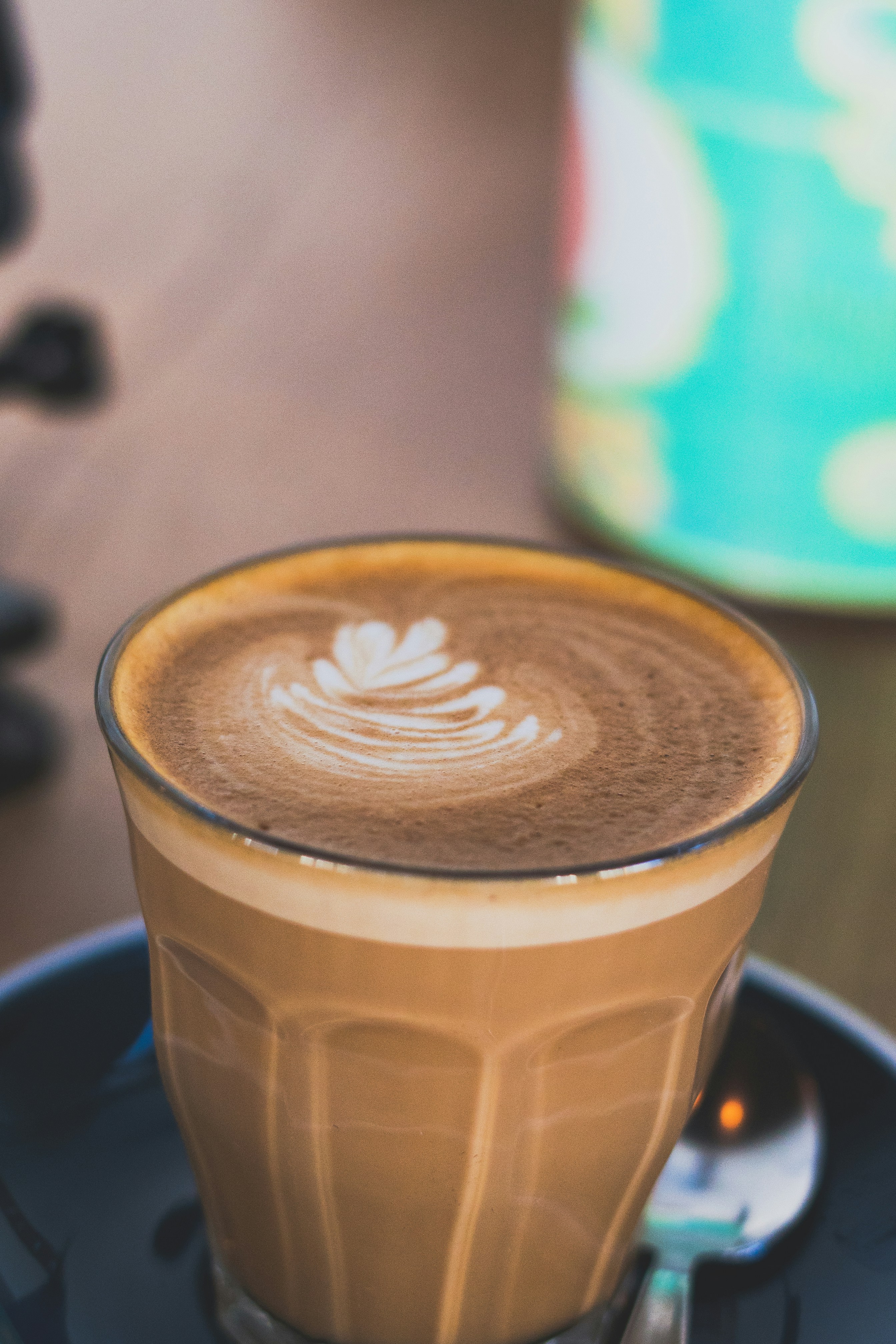 Latte Art in Focus: A Creamy Silhouette of Foam on a Glass