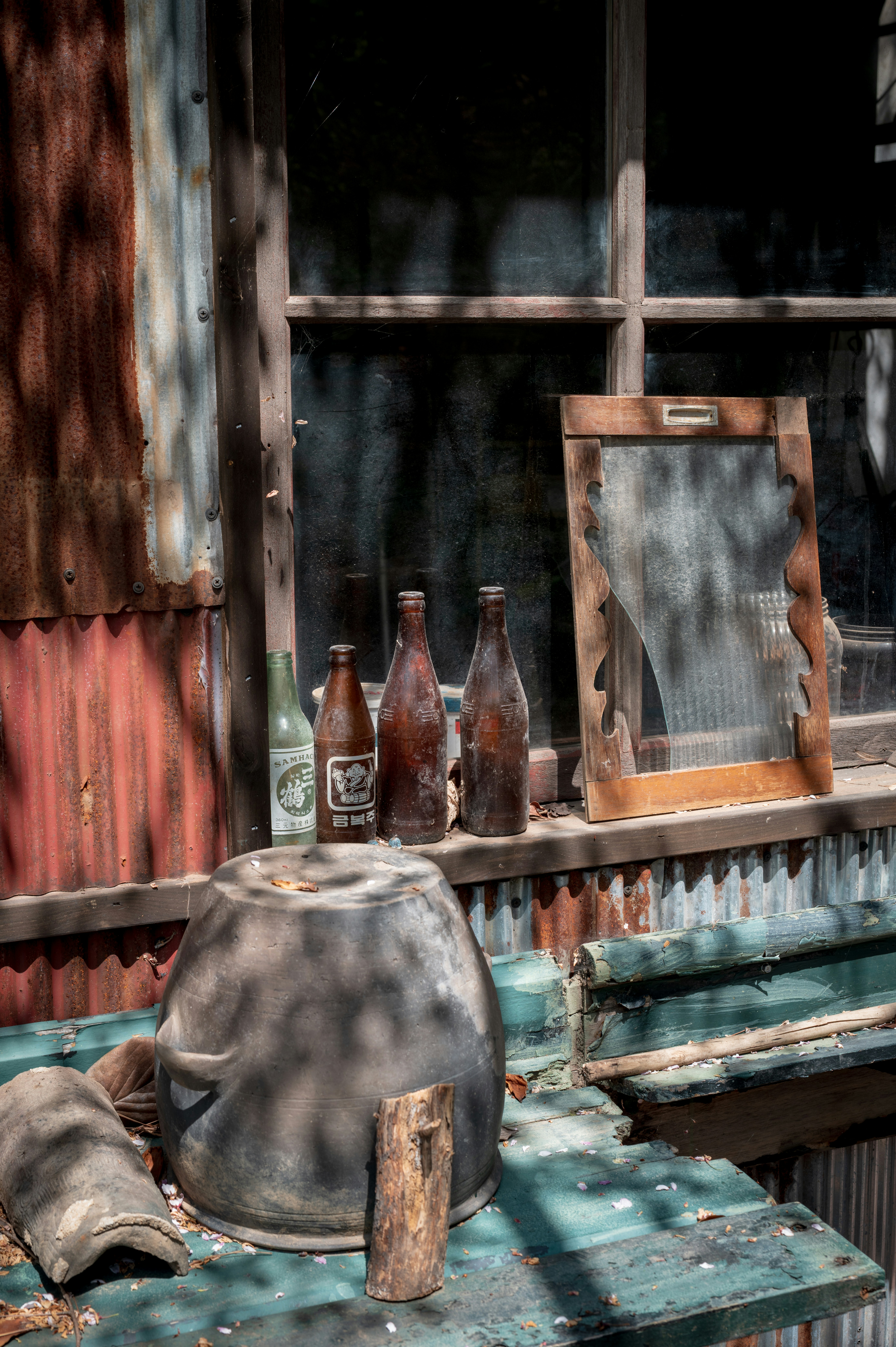 Rust and Reflections: A Weathered Still Life by the Window