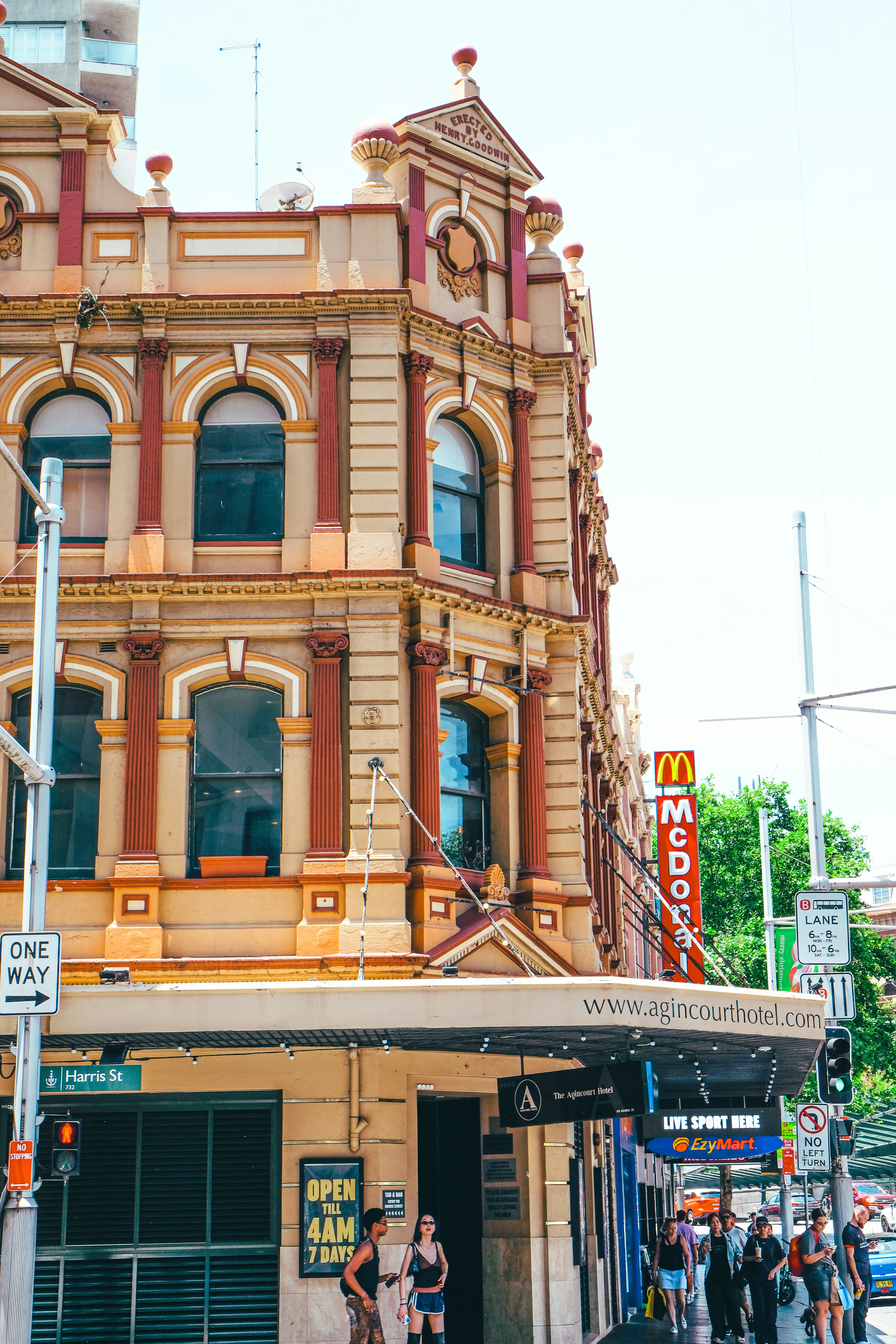 Ornate Hotel Facade Framing a Bustling Street Scene