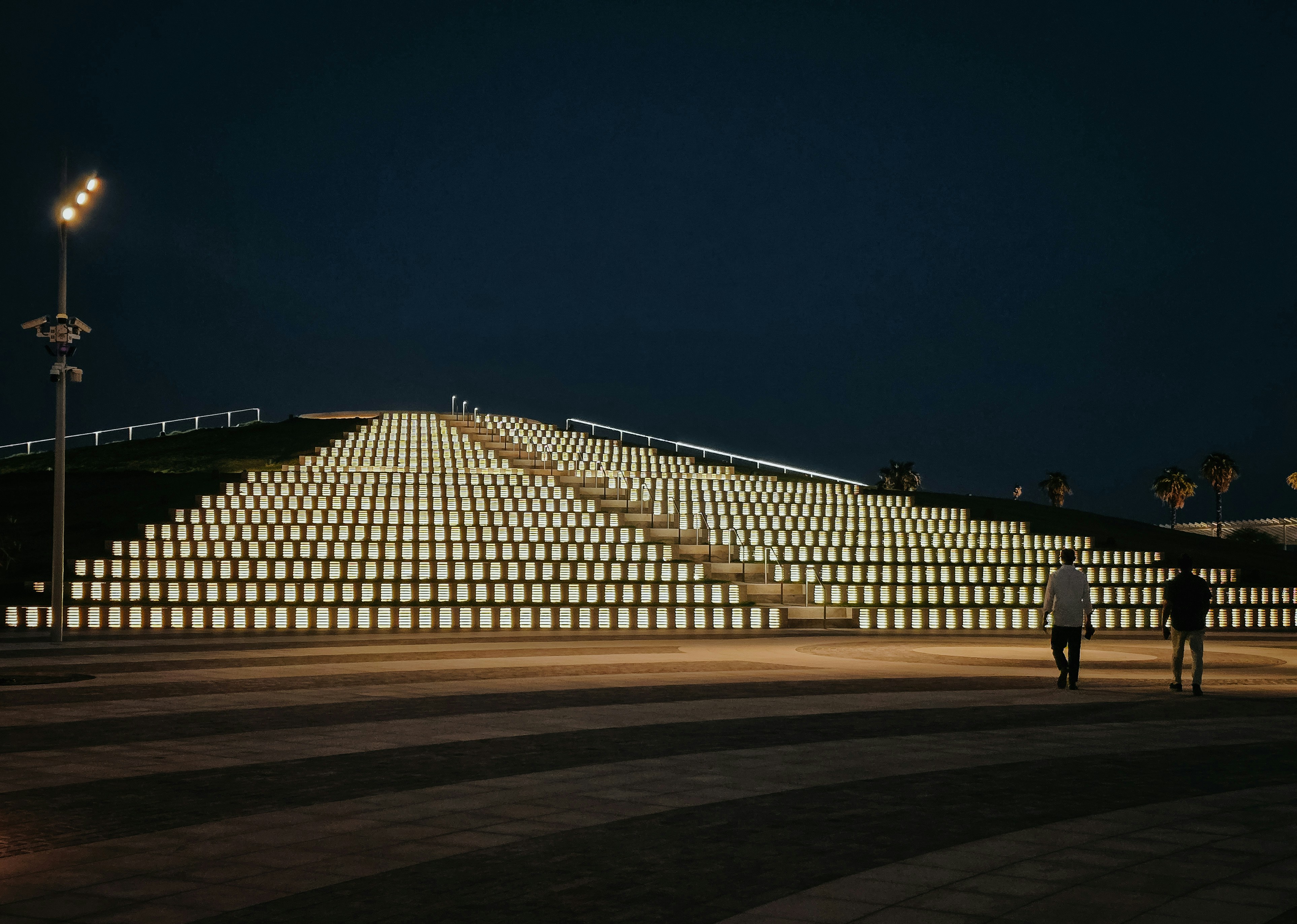 Silent amphitheater of light: Steps rising into night