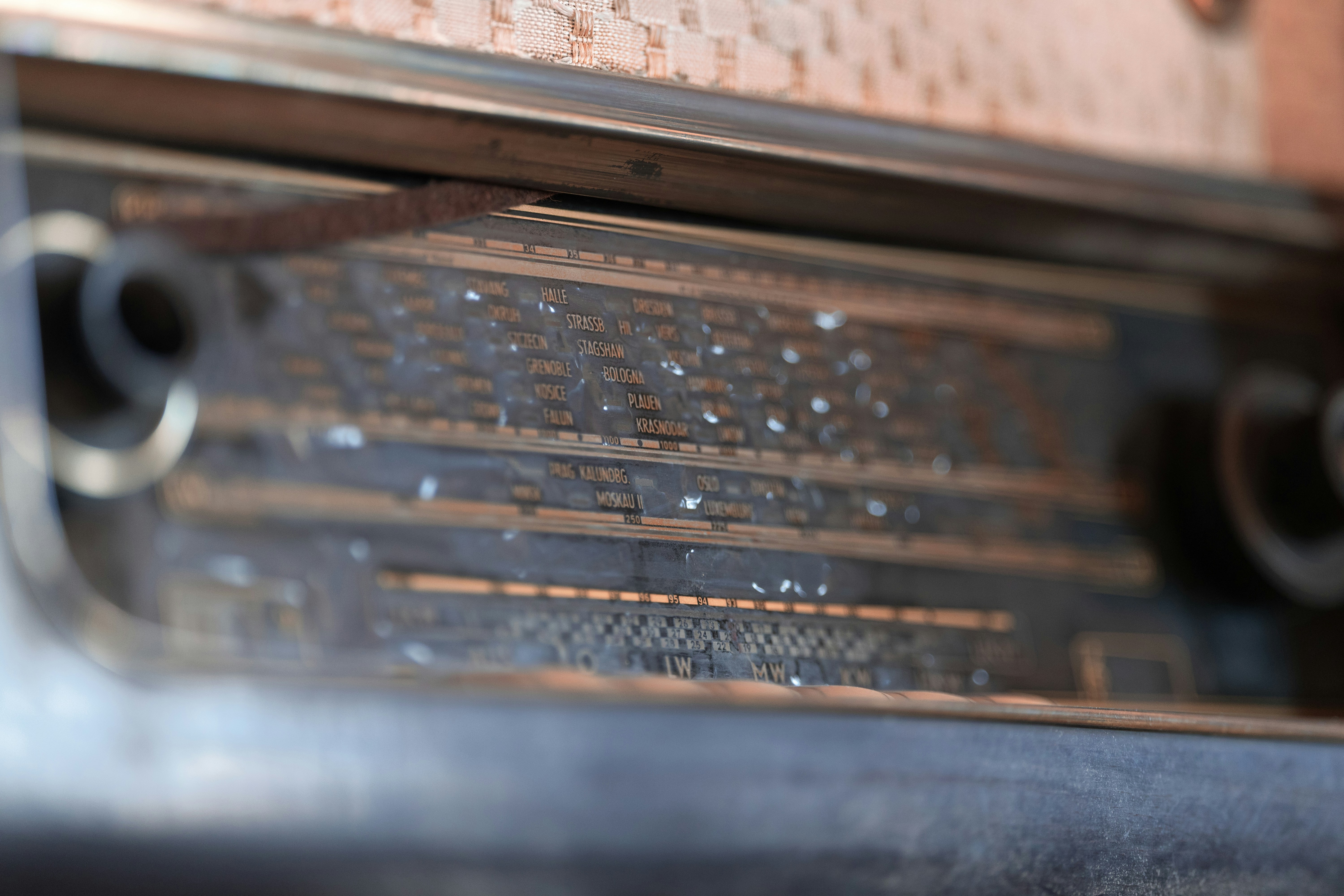 Dusty vintage radio dial—forgotten center stage in a quiet corner