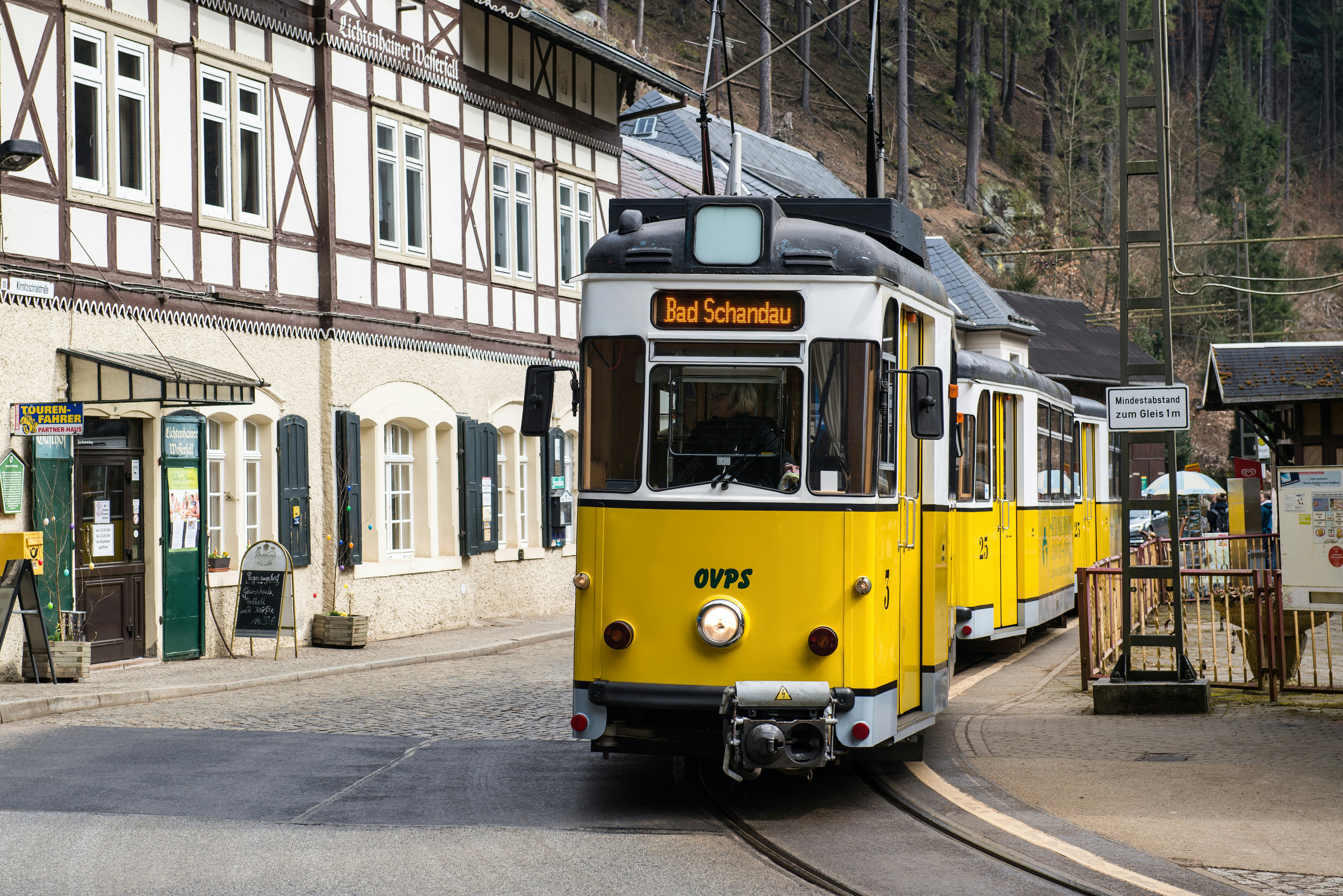 Yellow Tram at a German-style Train Station, The Village Edge