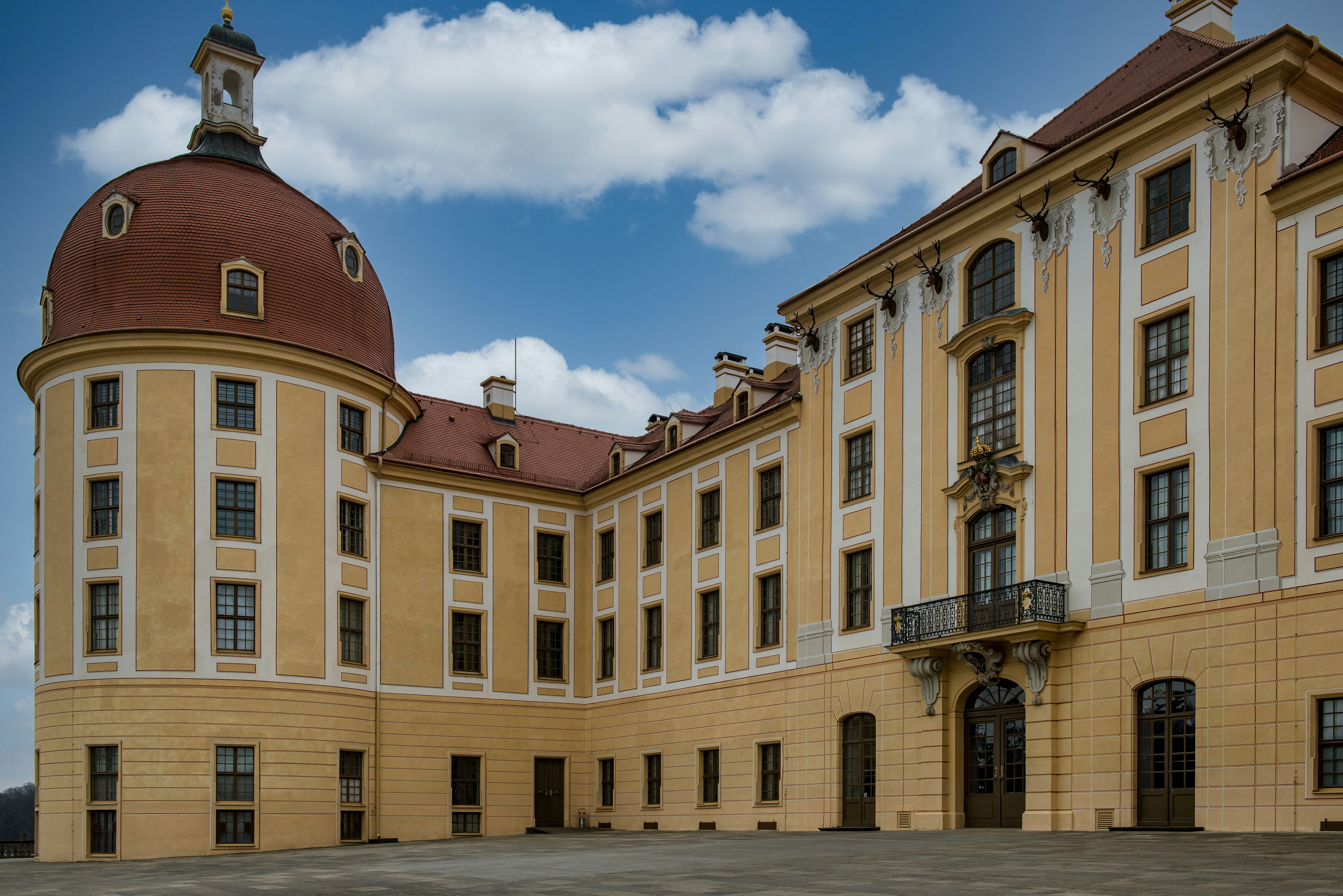 Courtyard Facade of a Baroque-style Castle at Noon