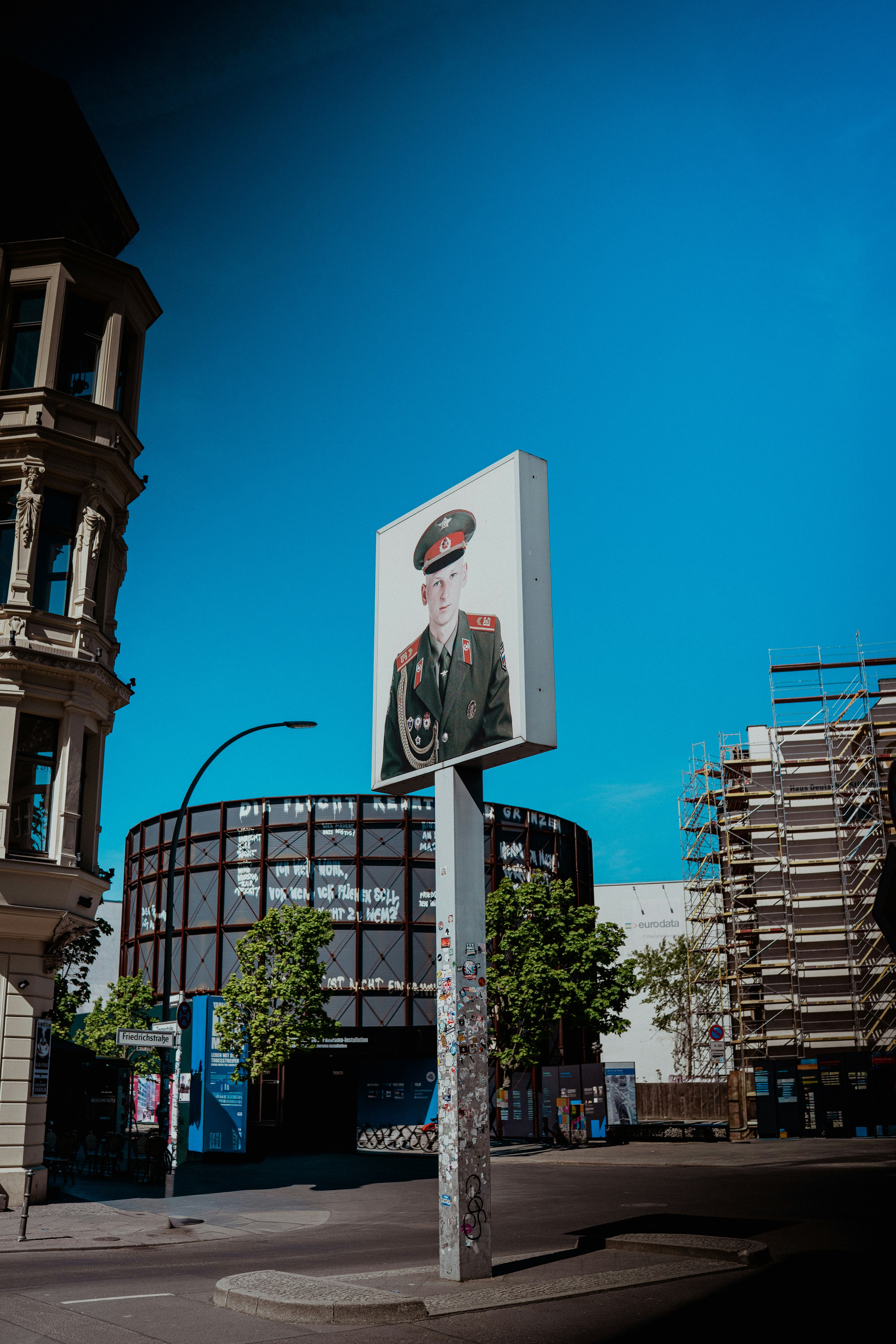 Street Portrait of a Monument Billboard Beneath a Bold Blue Sky